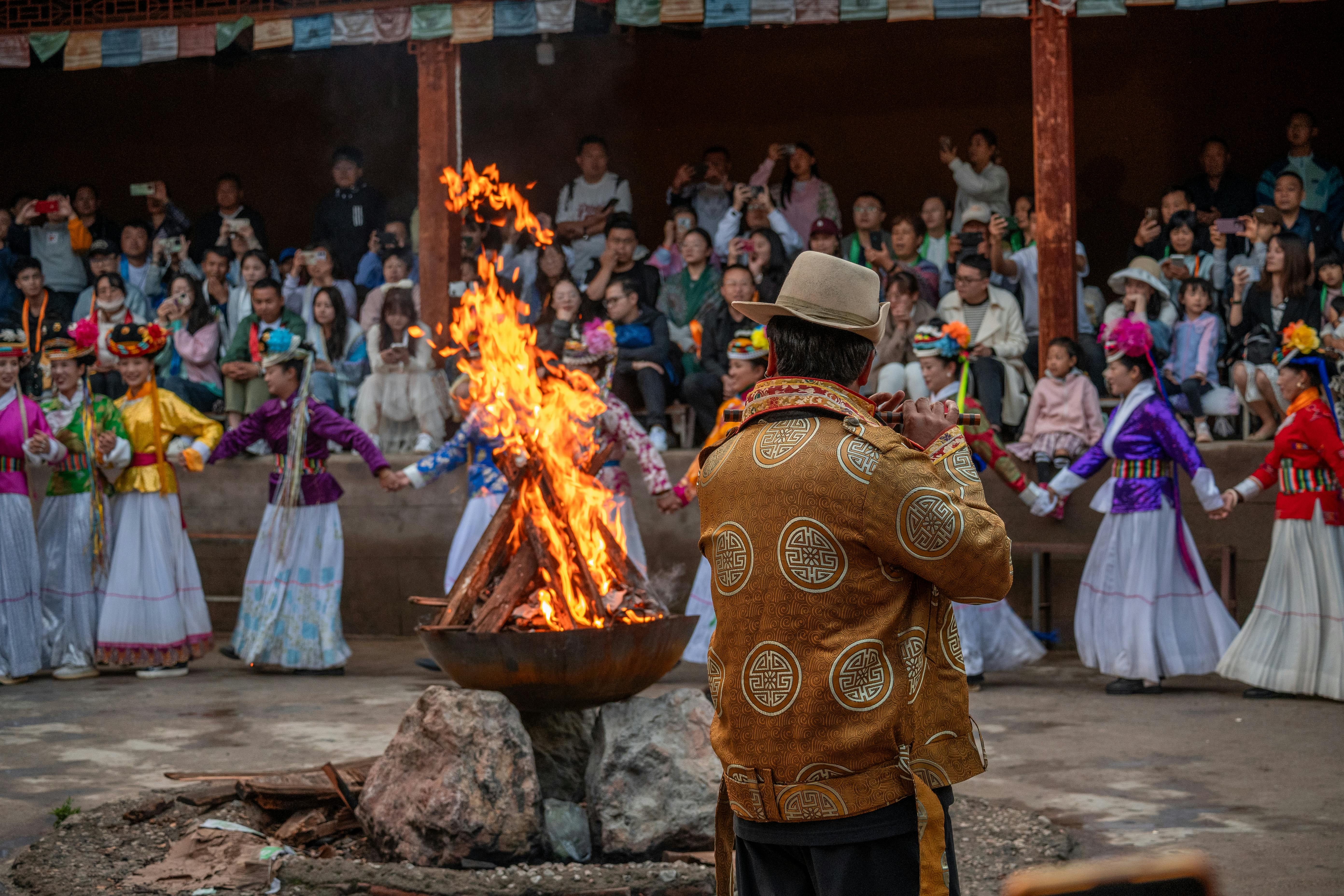 Women in Folk Costumes Dancing Around a Bonfire to Flute Music · Free ...