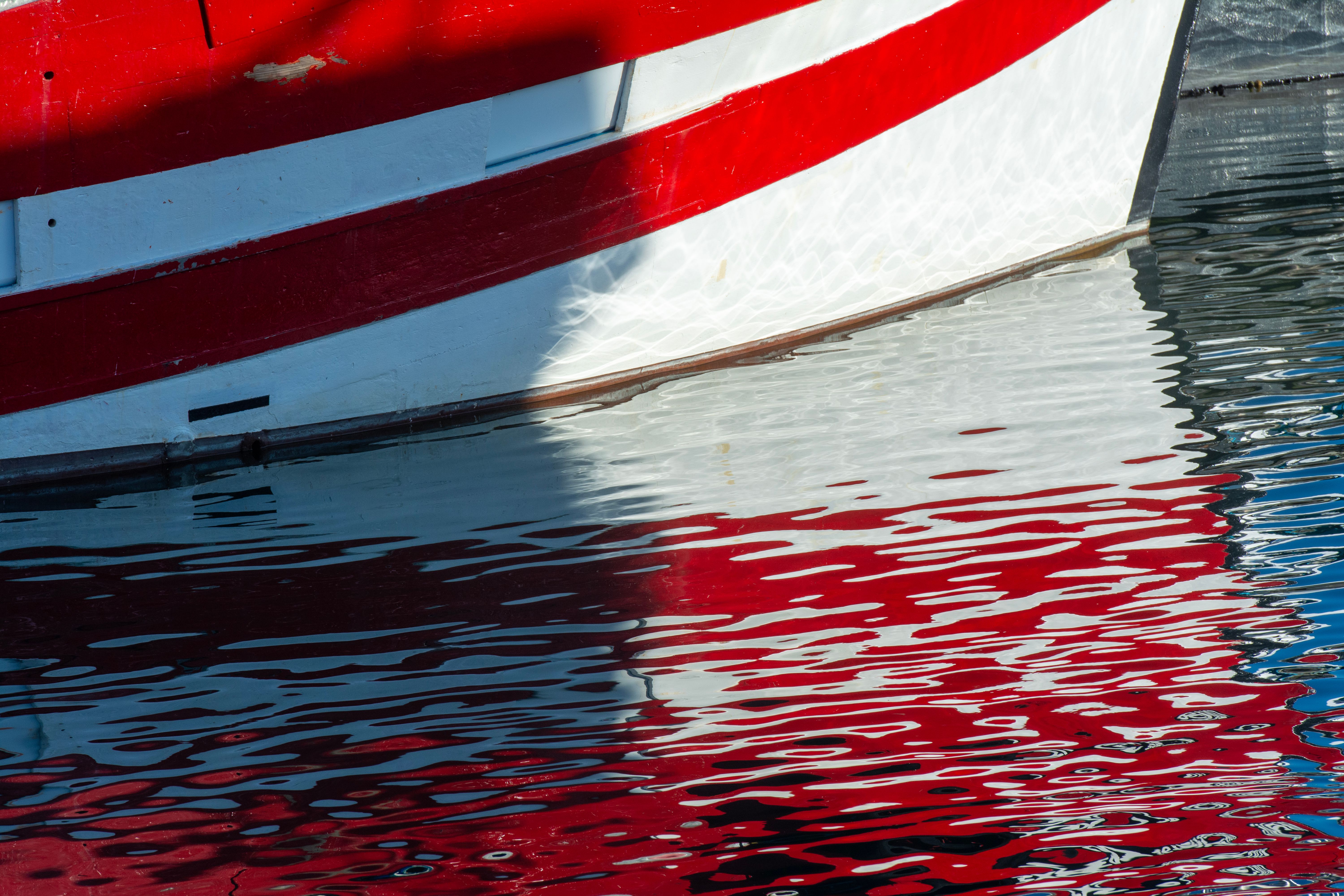 Close-up of a Boat Reflecting in the Water · Free Stock Photo