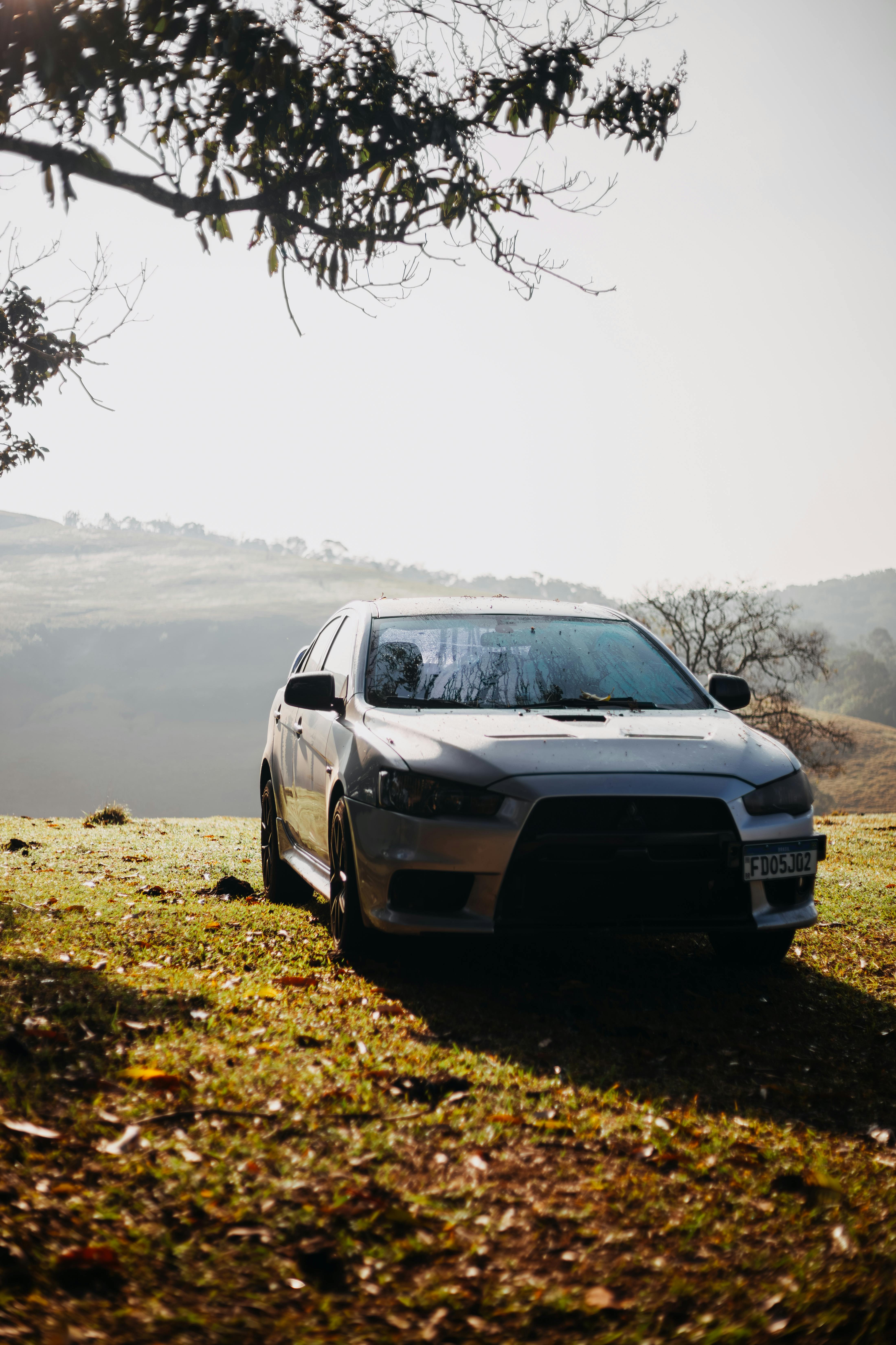 White Mitsubishi Lancer Evolution on the Race Track · Free Stock Photo