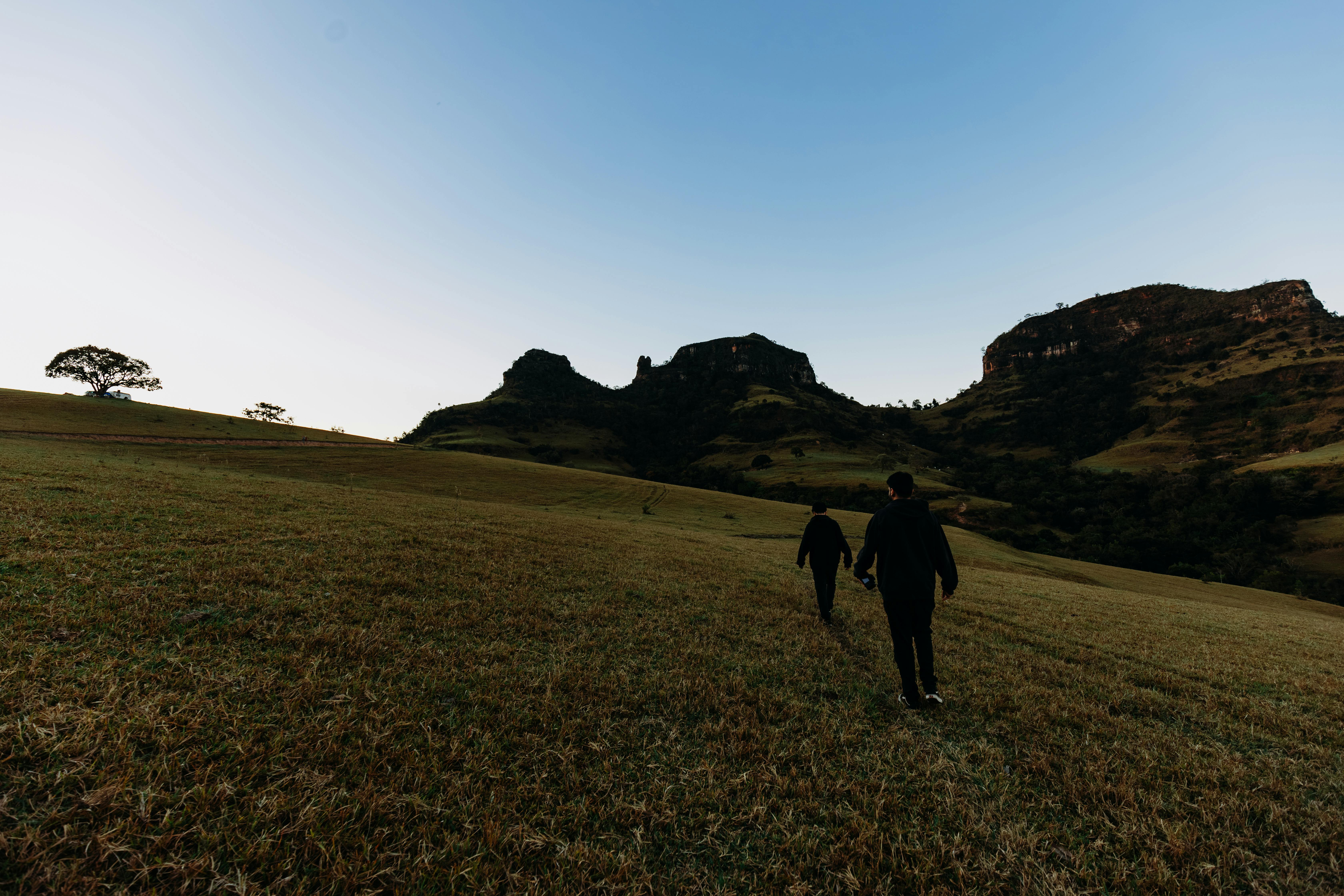 People Walking on a Hill Slope Towards Rock Formations in Botucatu ...