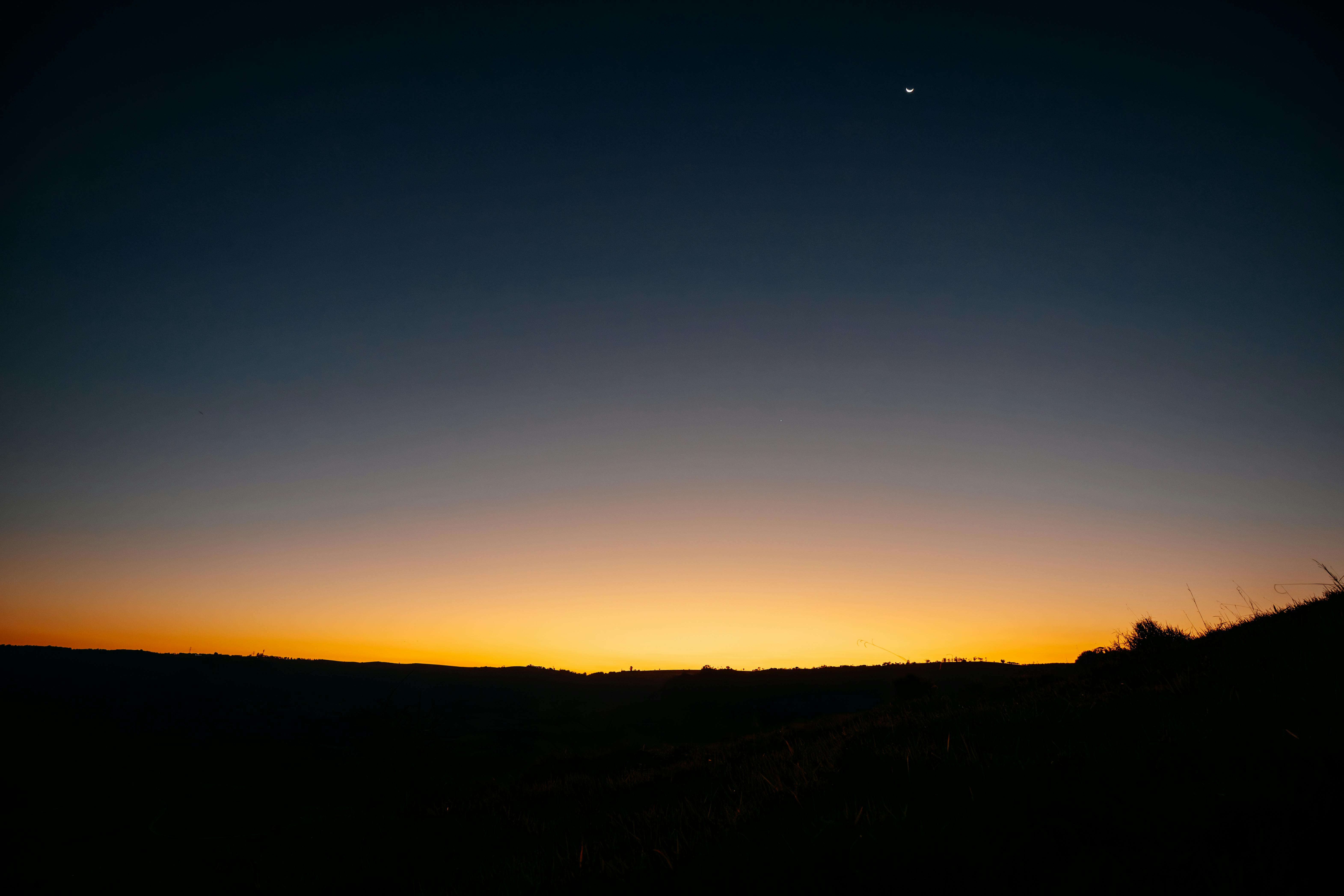 Sunset on Clear Sky over Plains · Free Stock Photo