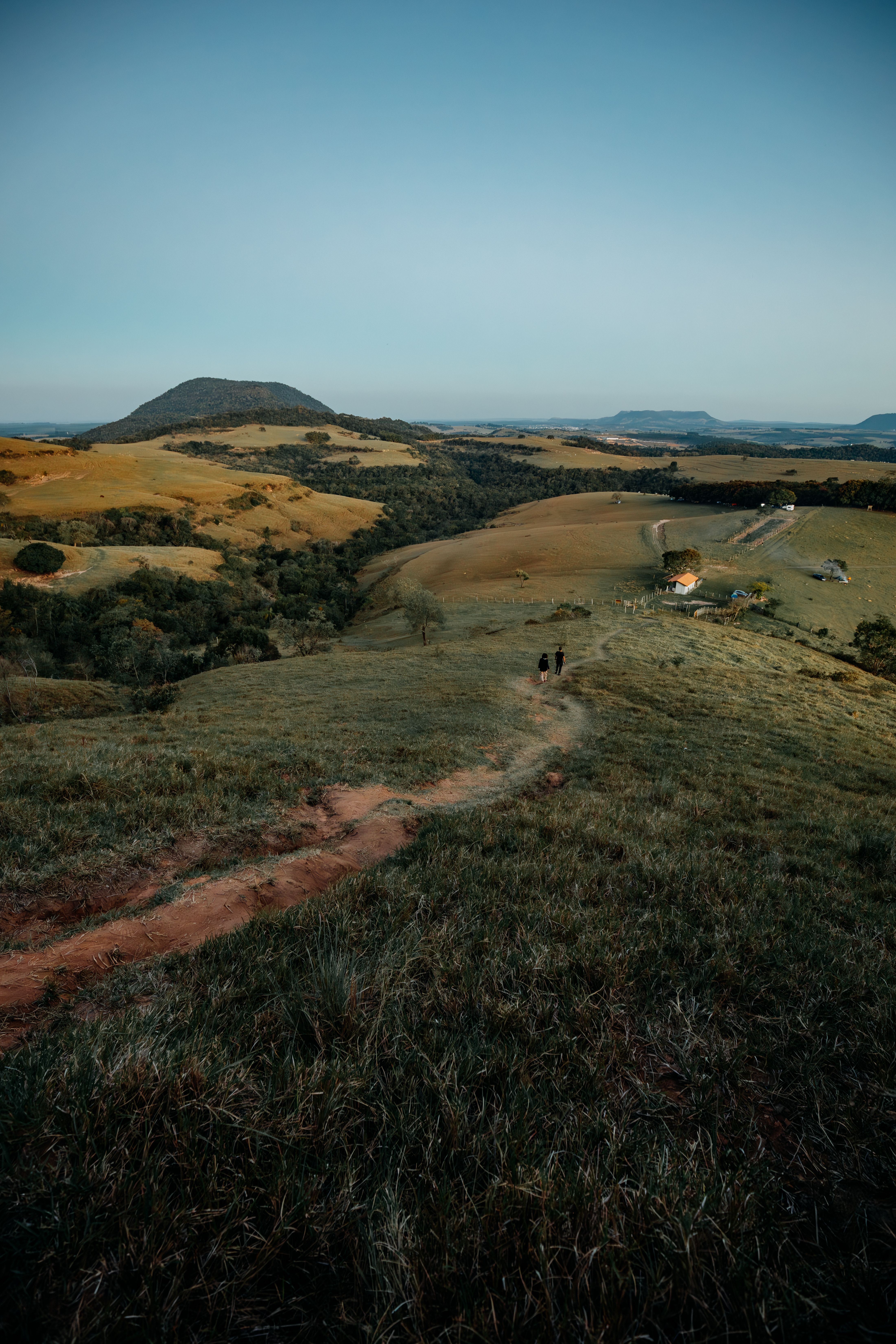 People on a Trail Leading Through Rolling Hilly Landscape · Free Stock ...