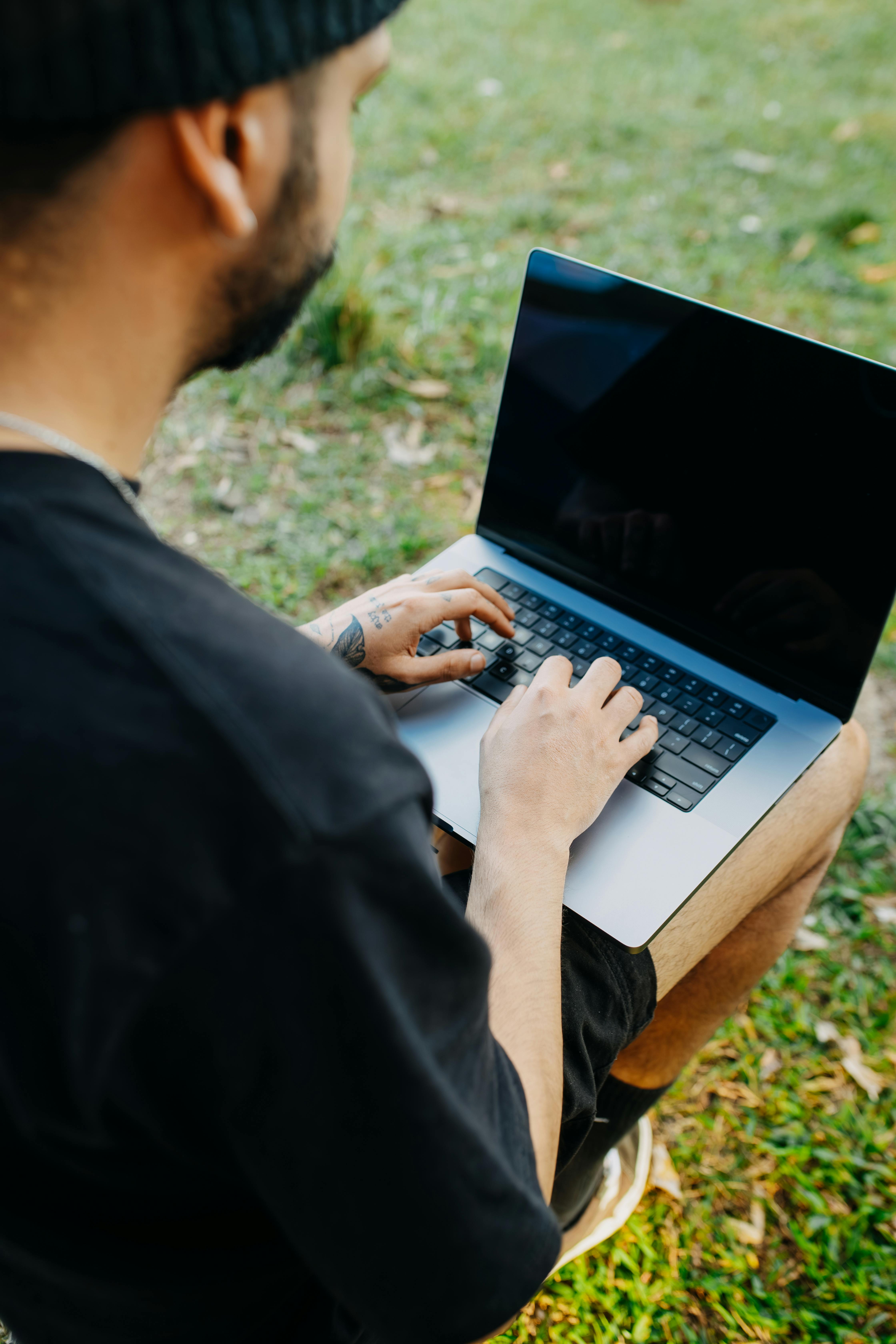 Man Holding Hands on Laptop · Free Stock Photo