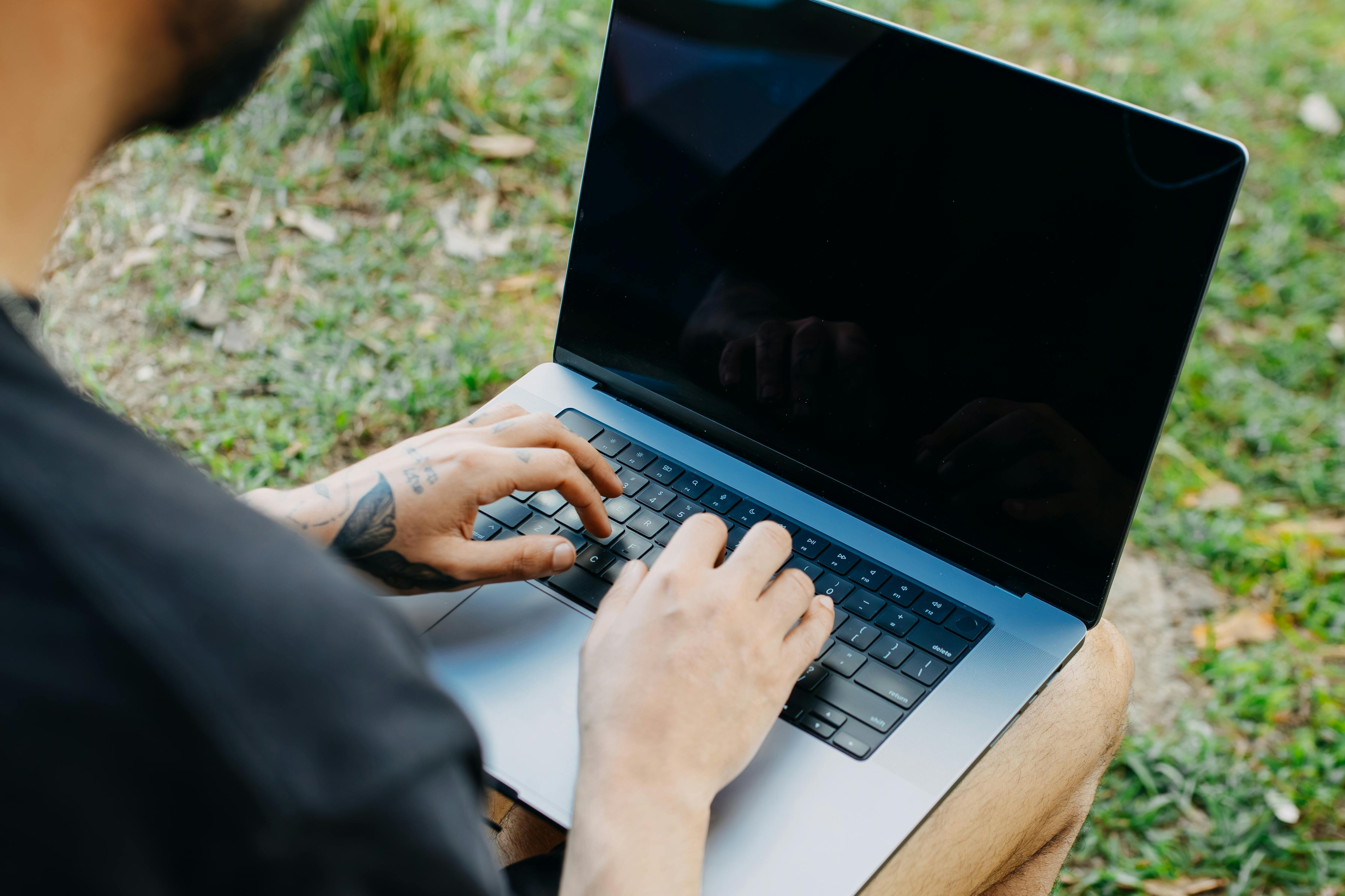 Man Holding Hands on Laptop · Free Stock Photo