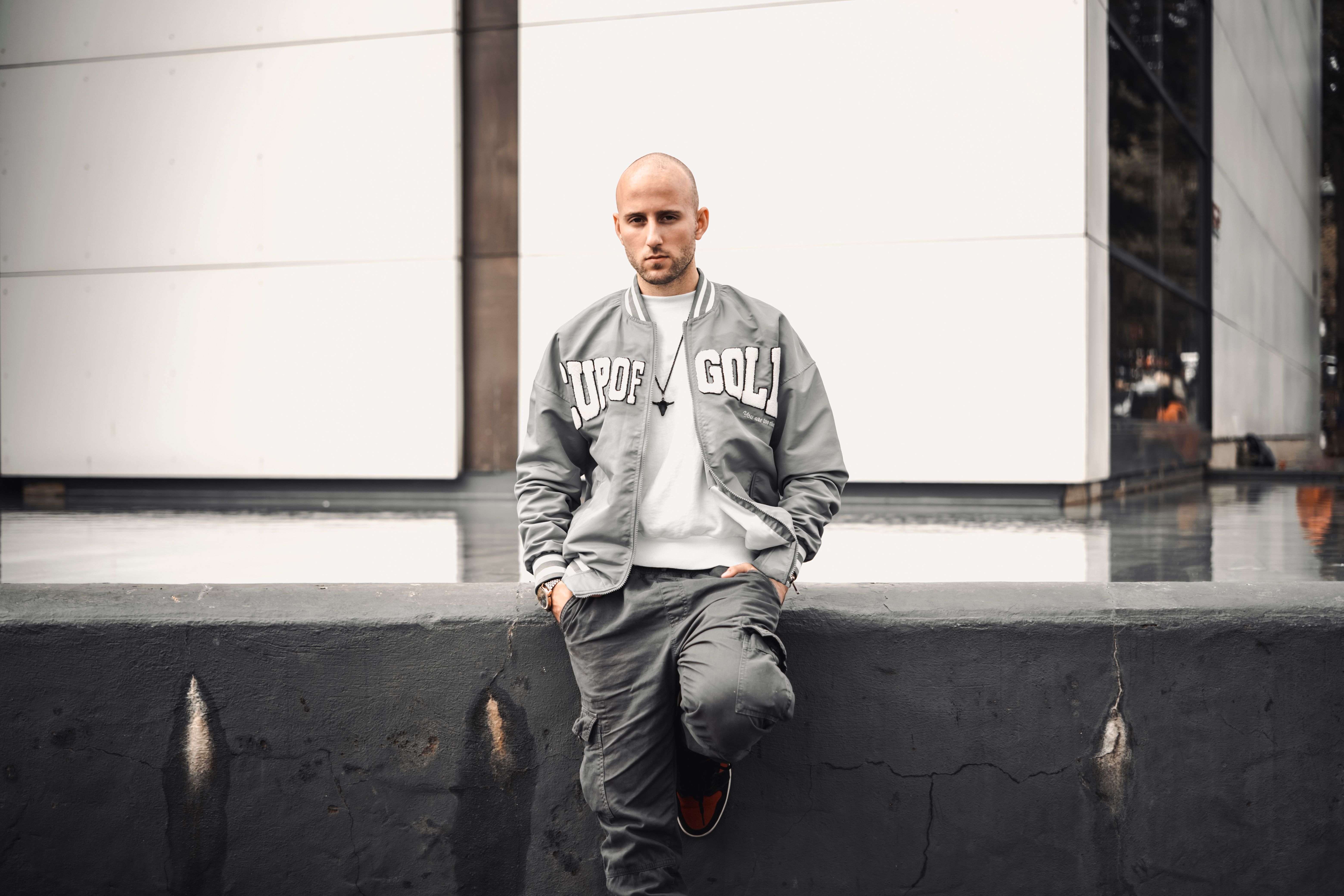 Man in Red Hoodie Jacket with Hand in Pocket · Free Stock Photo