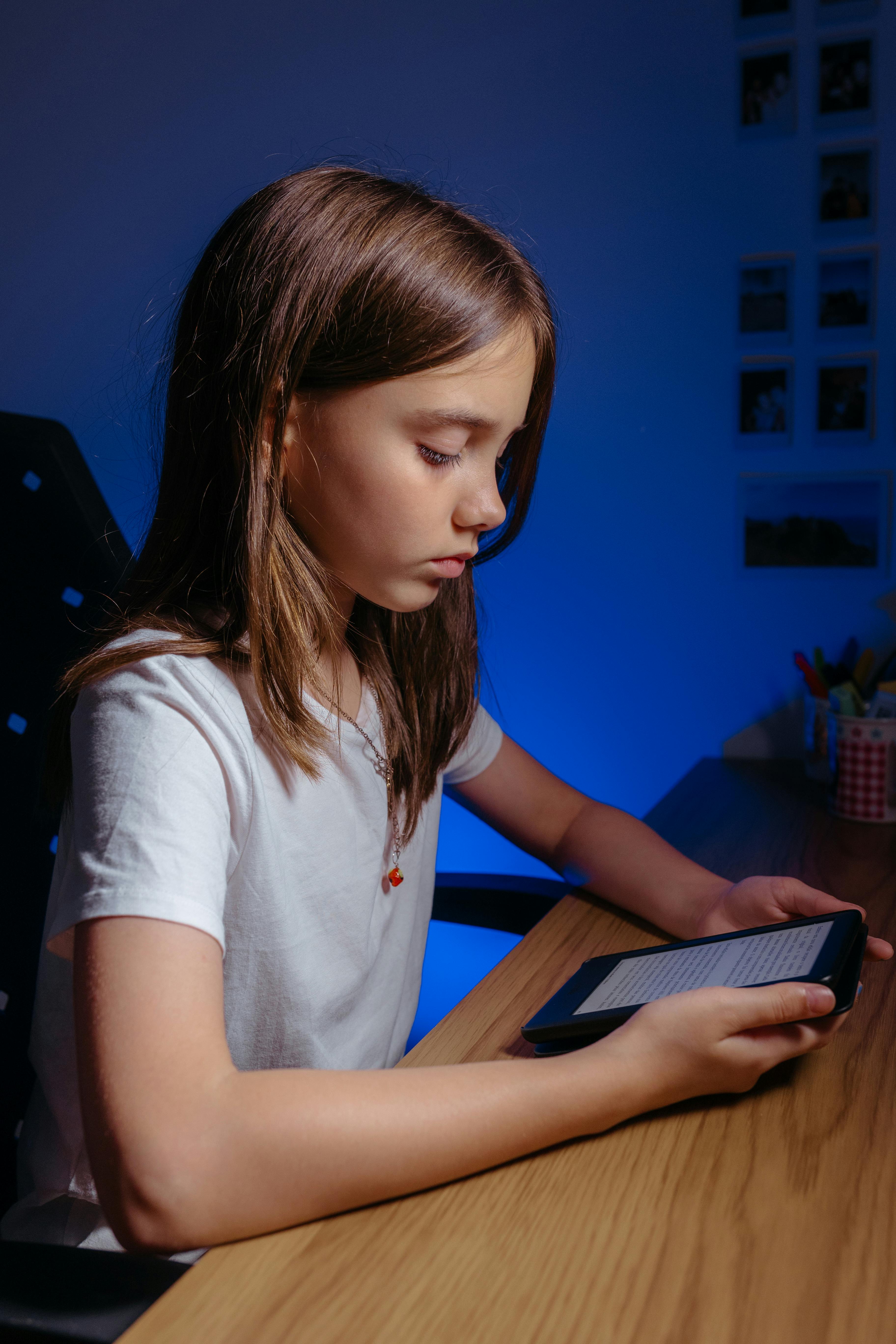 Girl Sitting with Tablet · Free Stock Photo