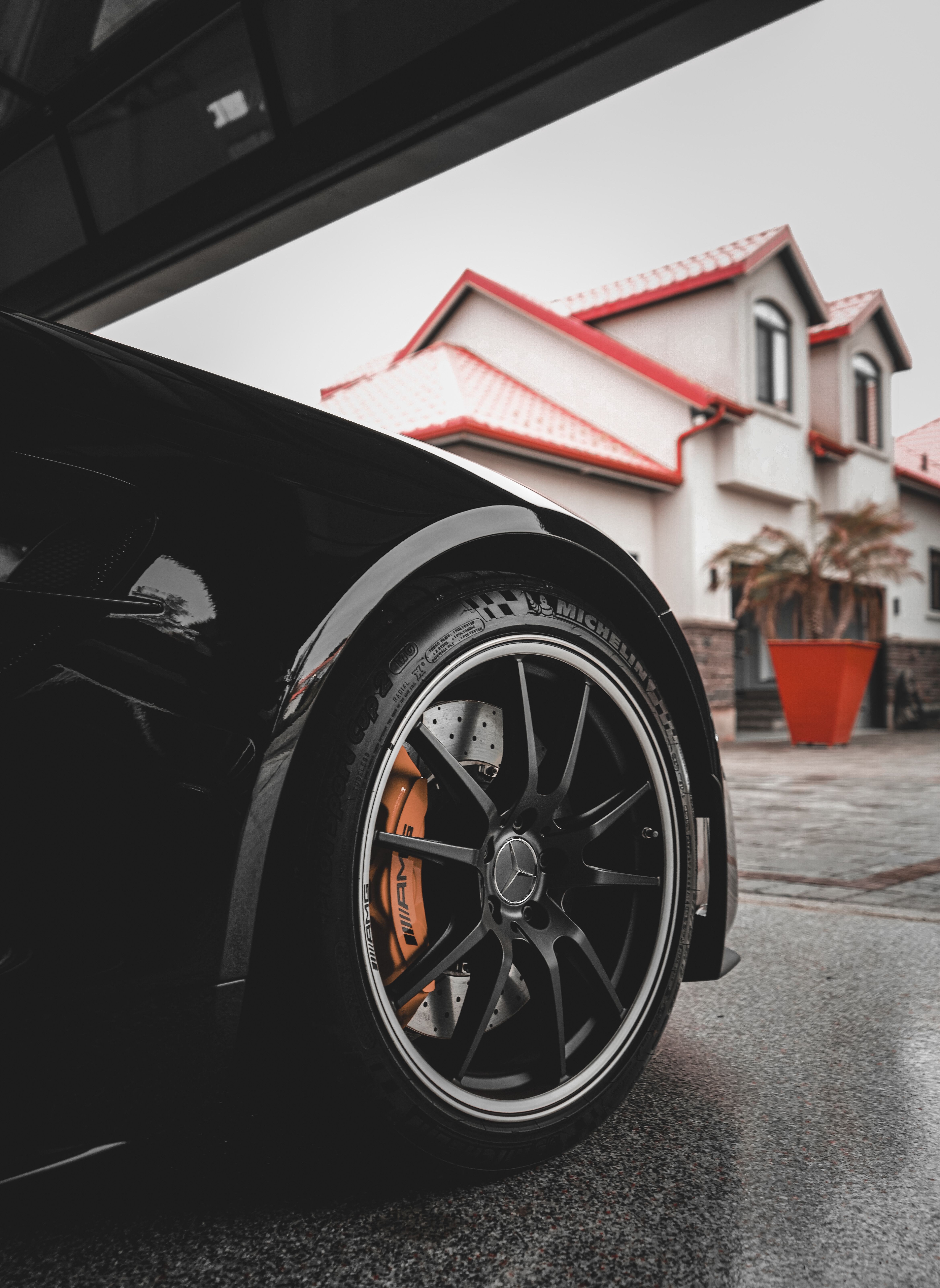Wheel of Black Car in Garage · Free Stock Photo