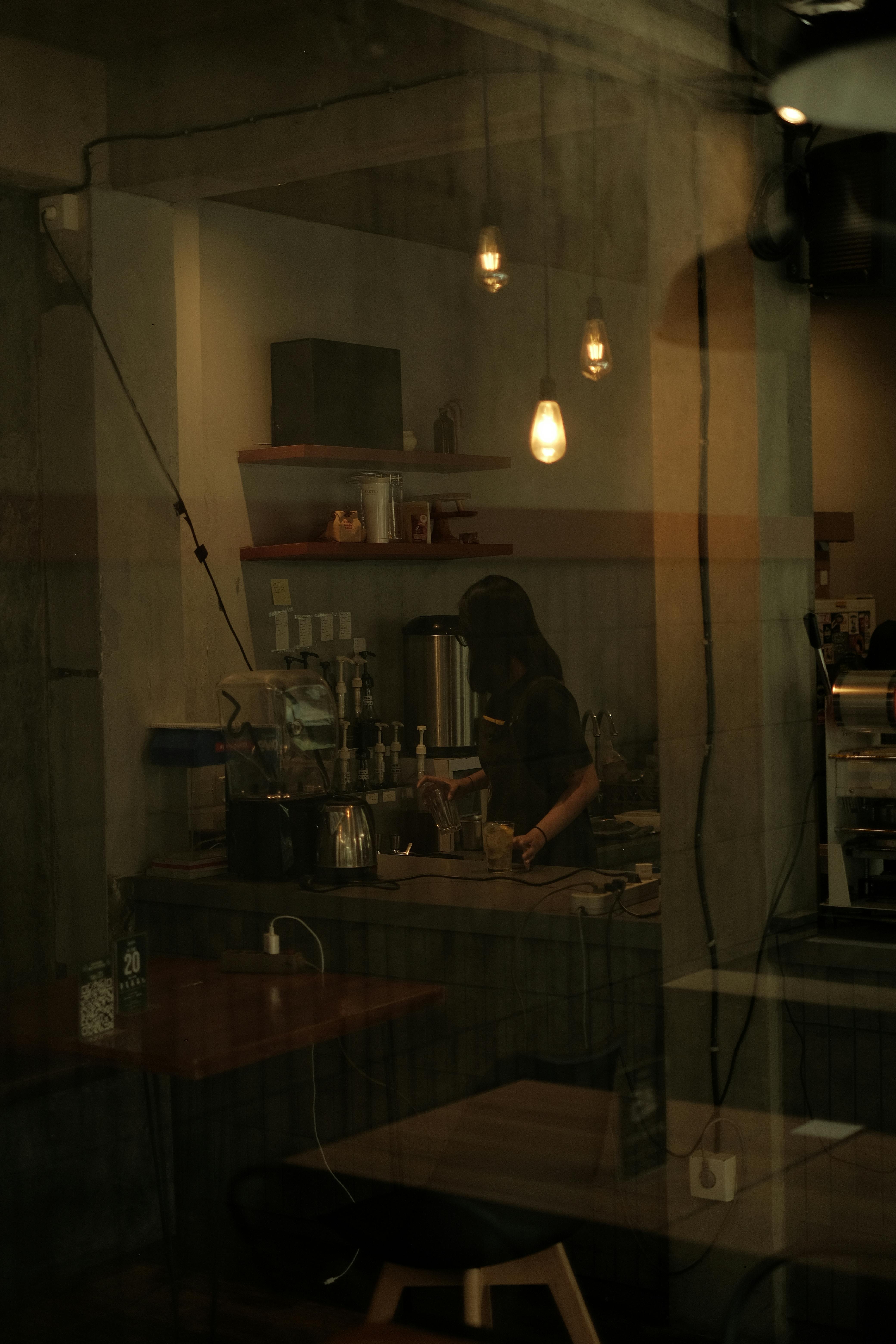 Woman behind Window Cafe Window · Free Stock Photo