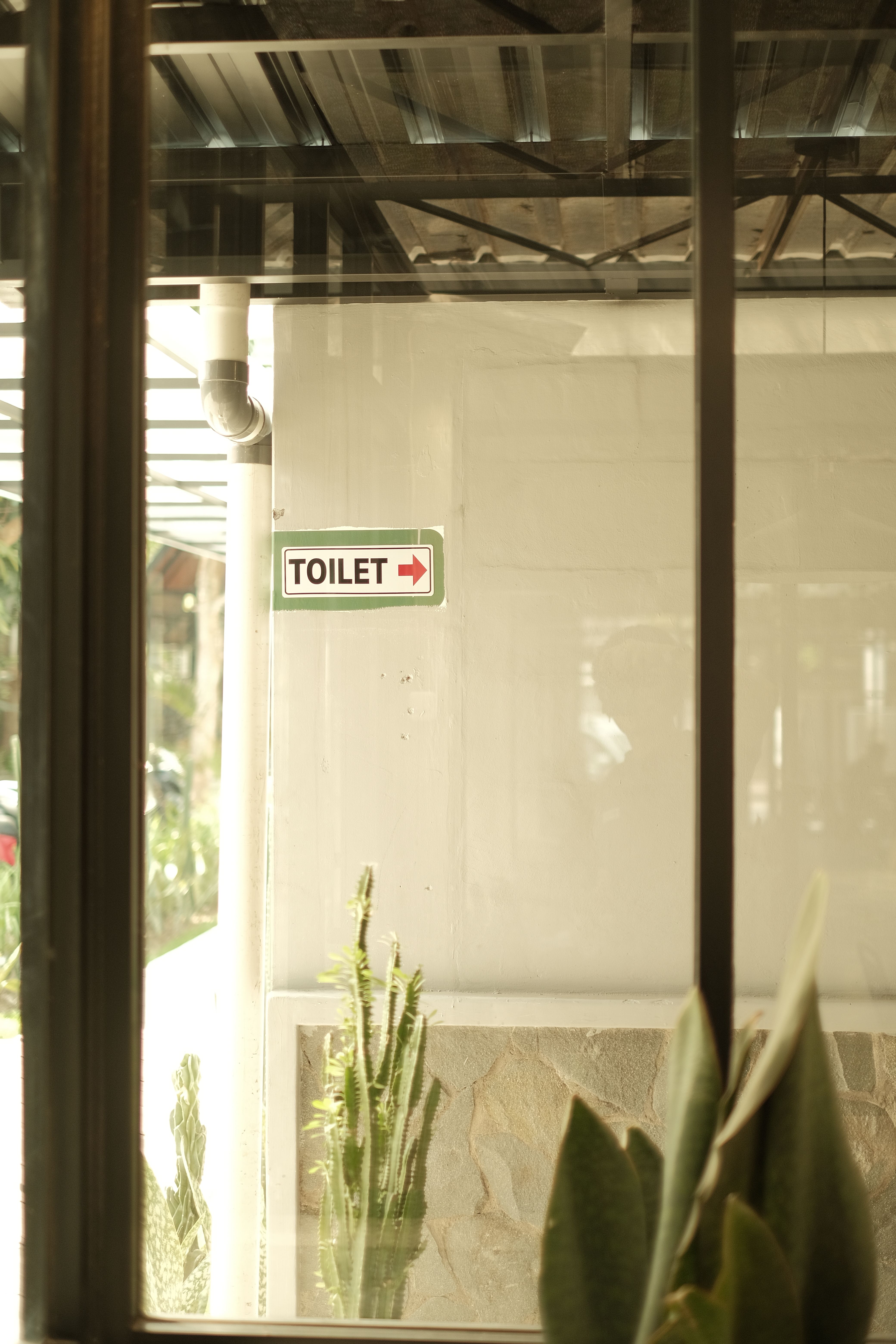Direction to Toilet on Window · Free Stock Photo