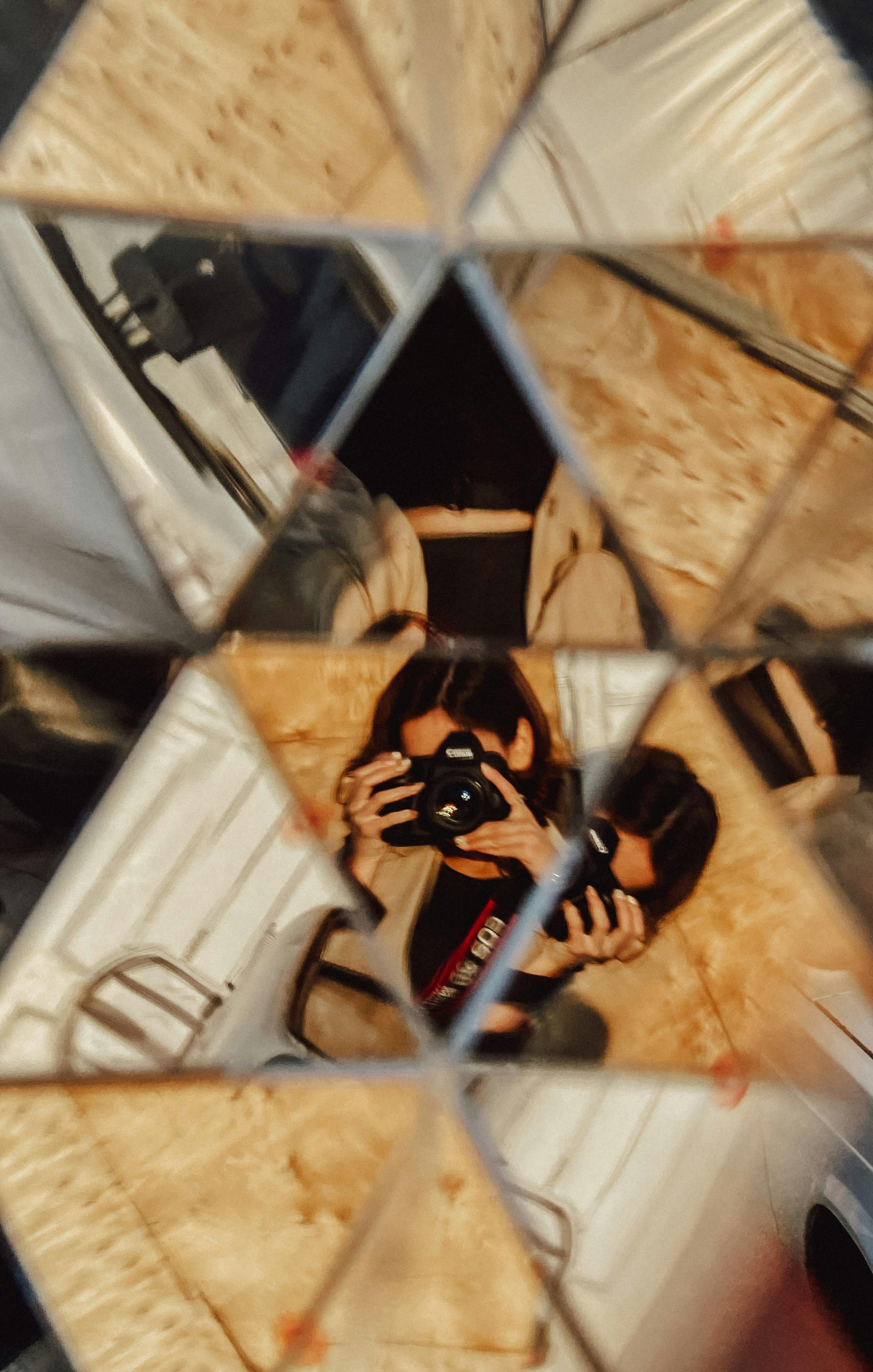 Woman Reflecting in Geometric Mirrors · Free Stock Photo