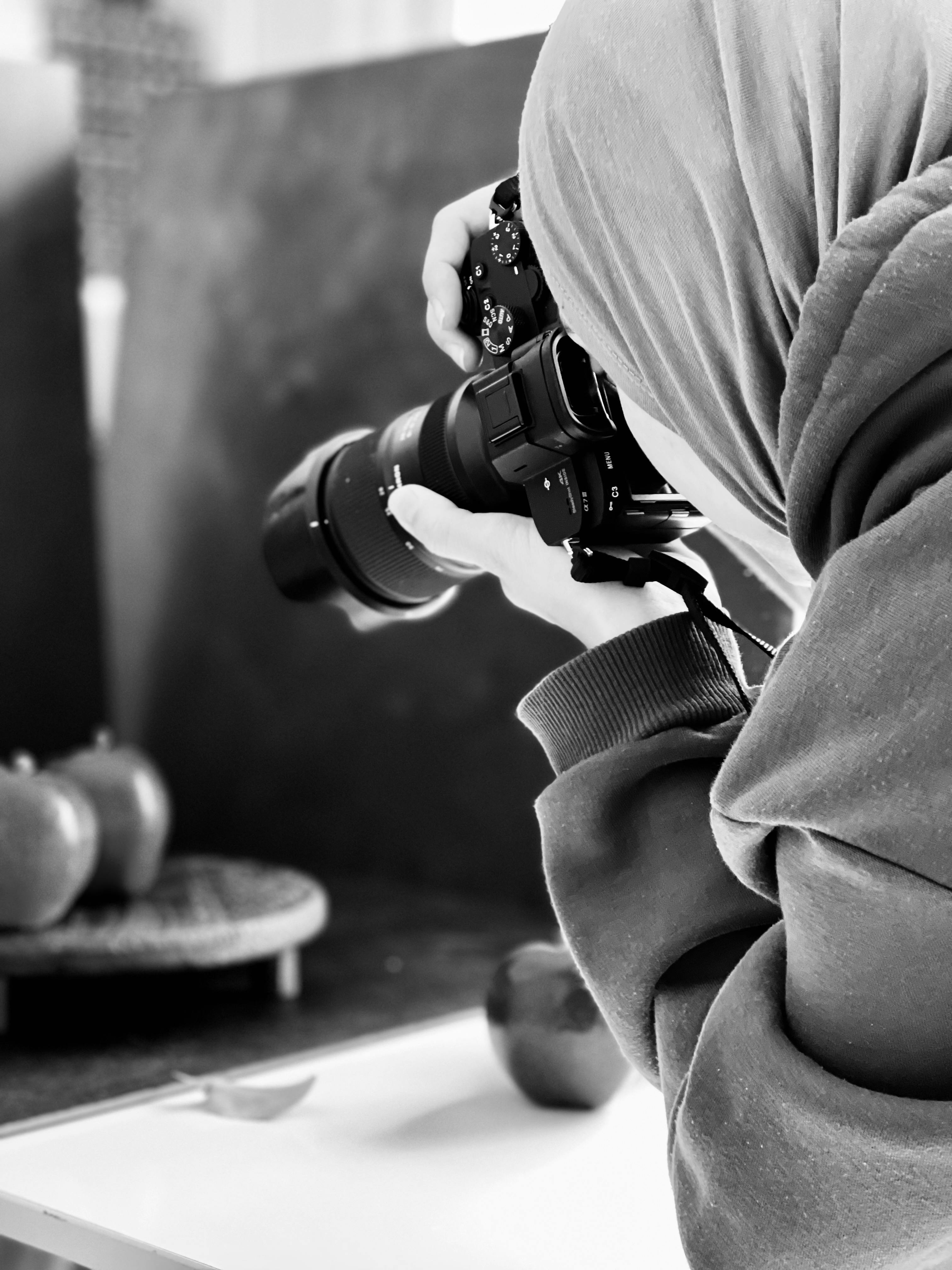 Woman Using a Camera · Free Stock Photo