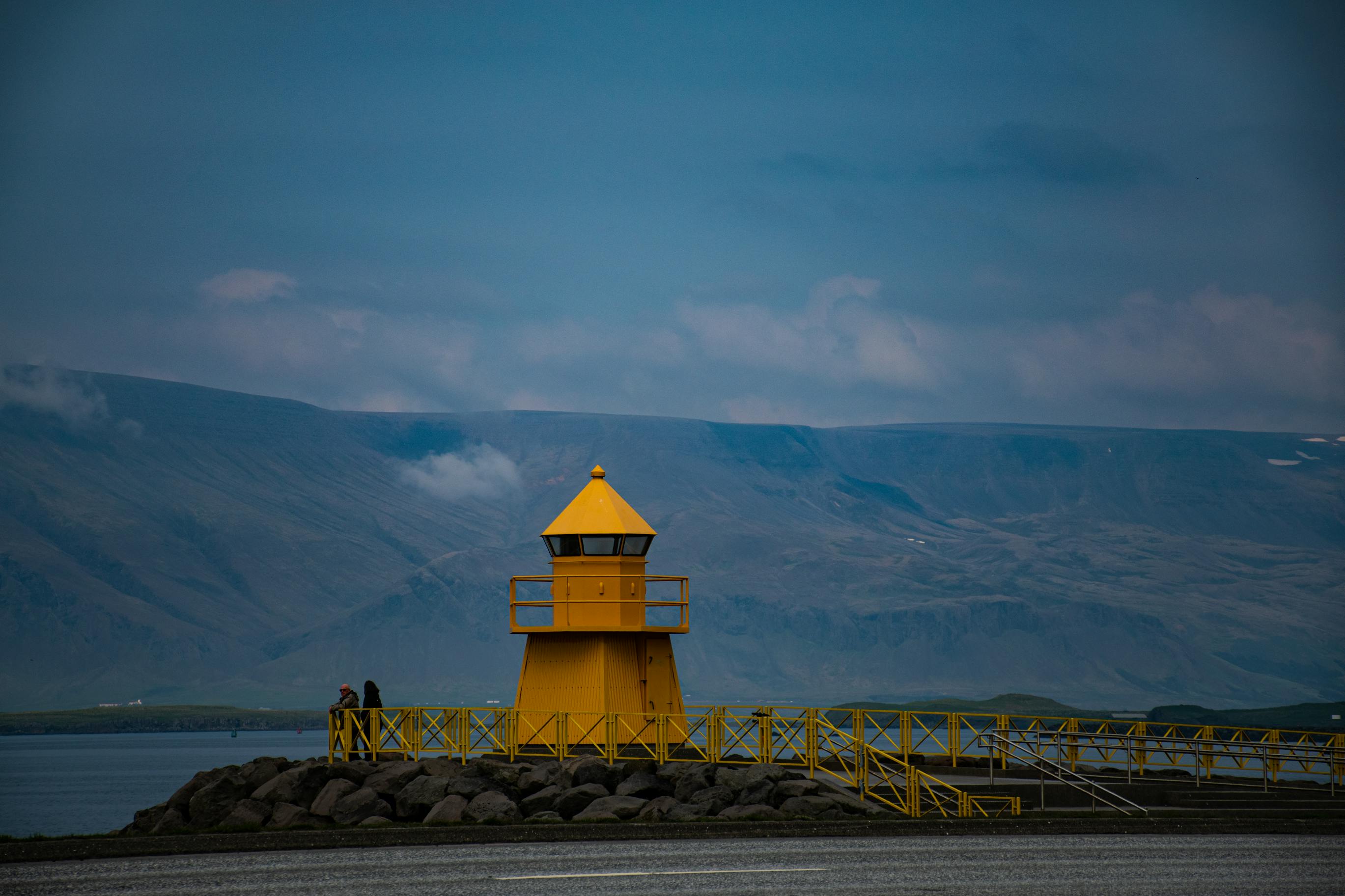 Yellow Lighthouse on Sea Coast · Free Stock Photo