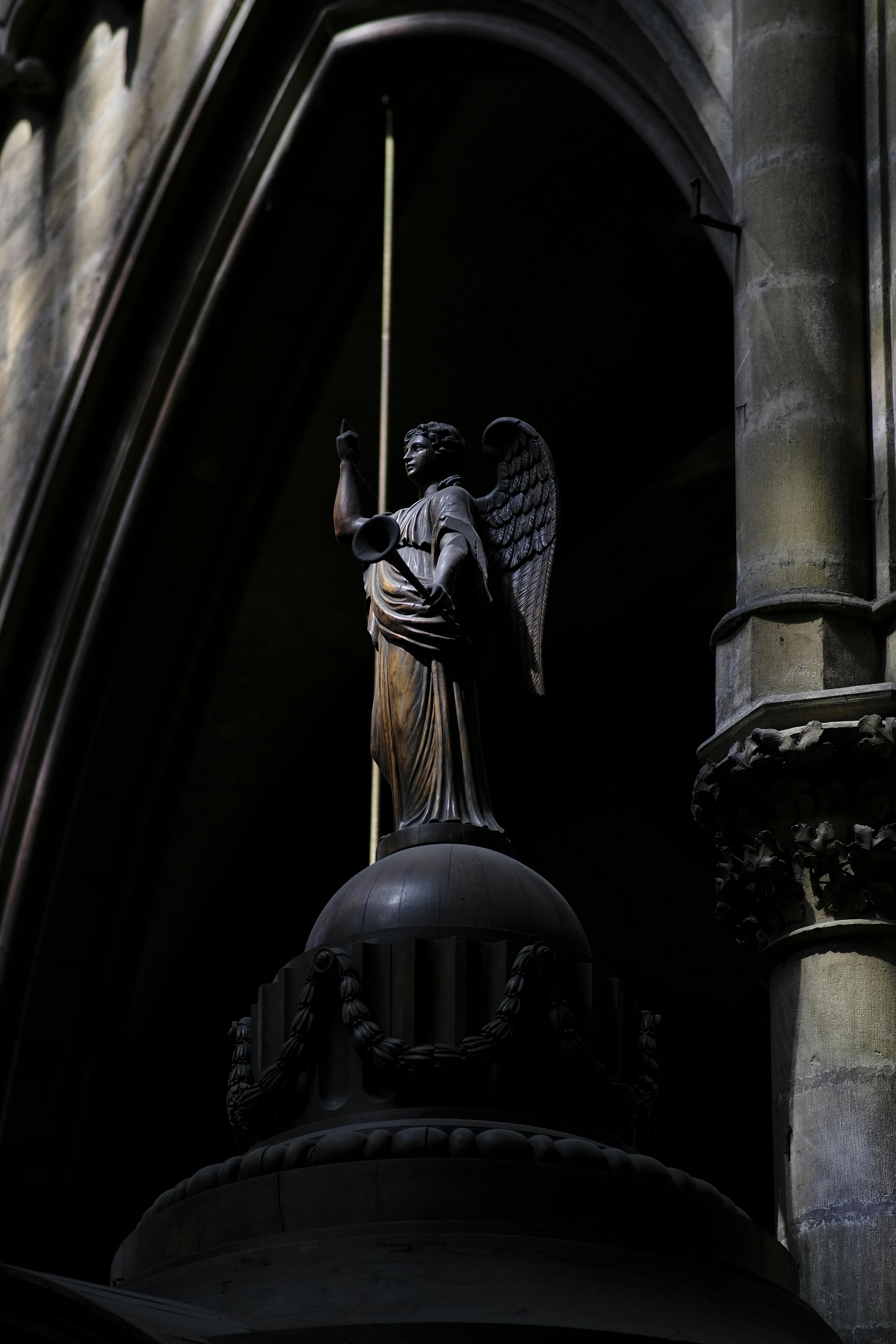 Angel Statue In Between Trees · Free Stock Photo