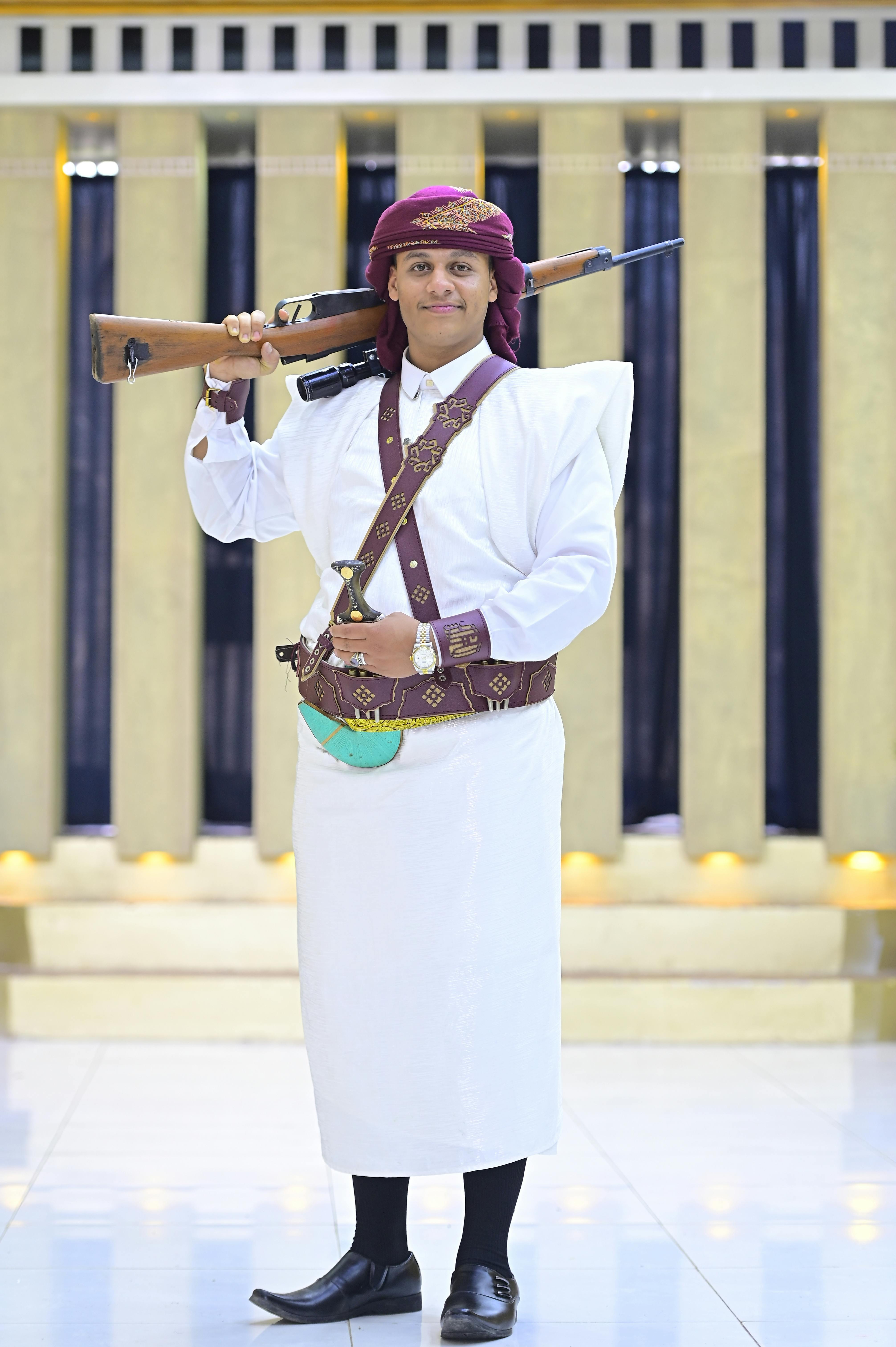 Traditionally Dressed Man in a Purple Turban and Bandolier with a Rifle ...