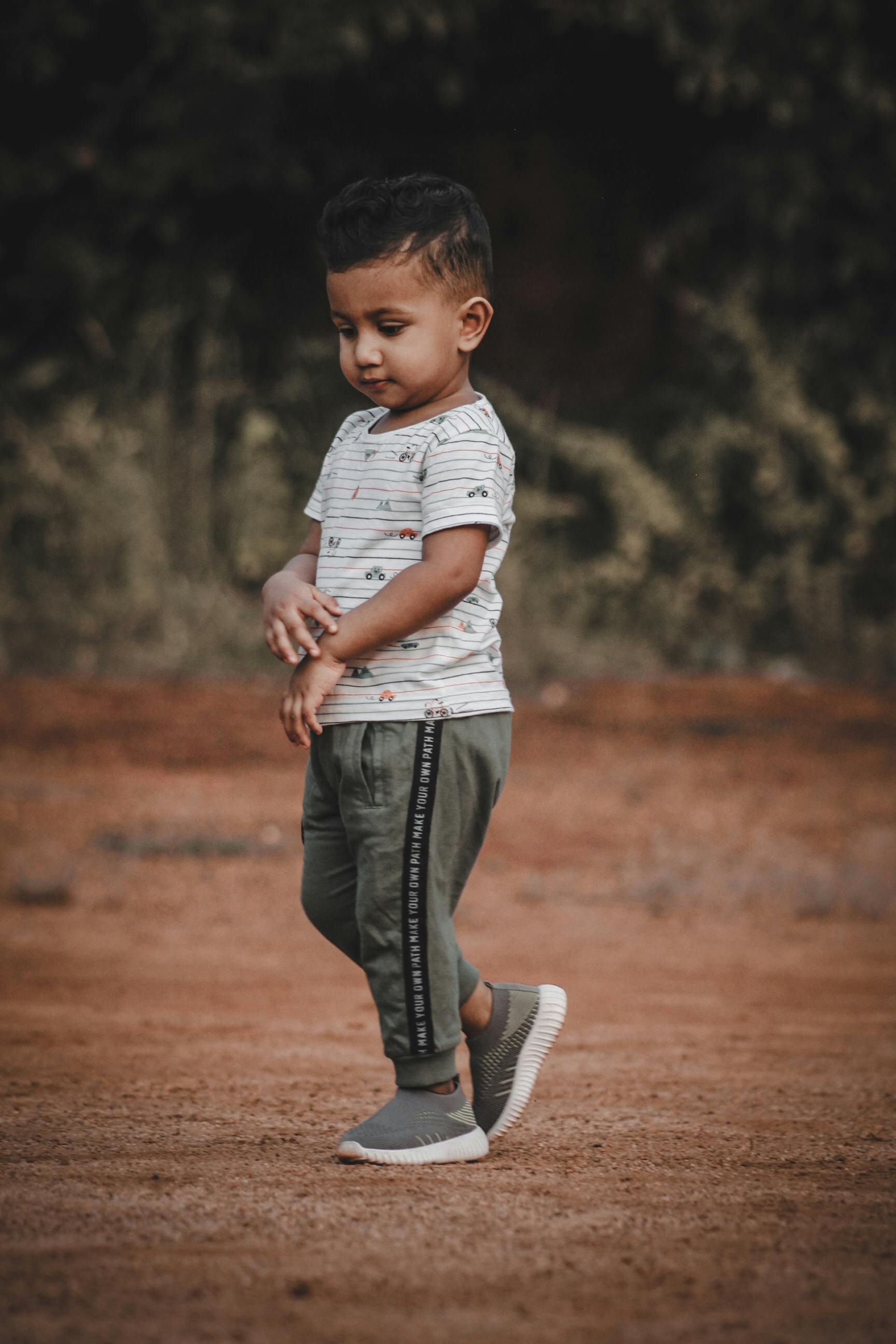 A Little Boy Walking Outside · Free Stock Photo