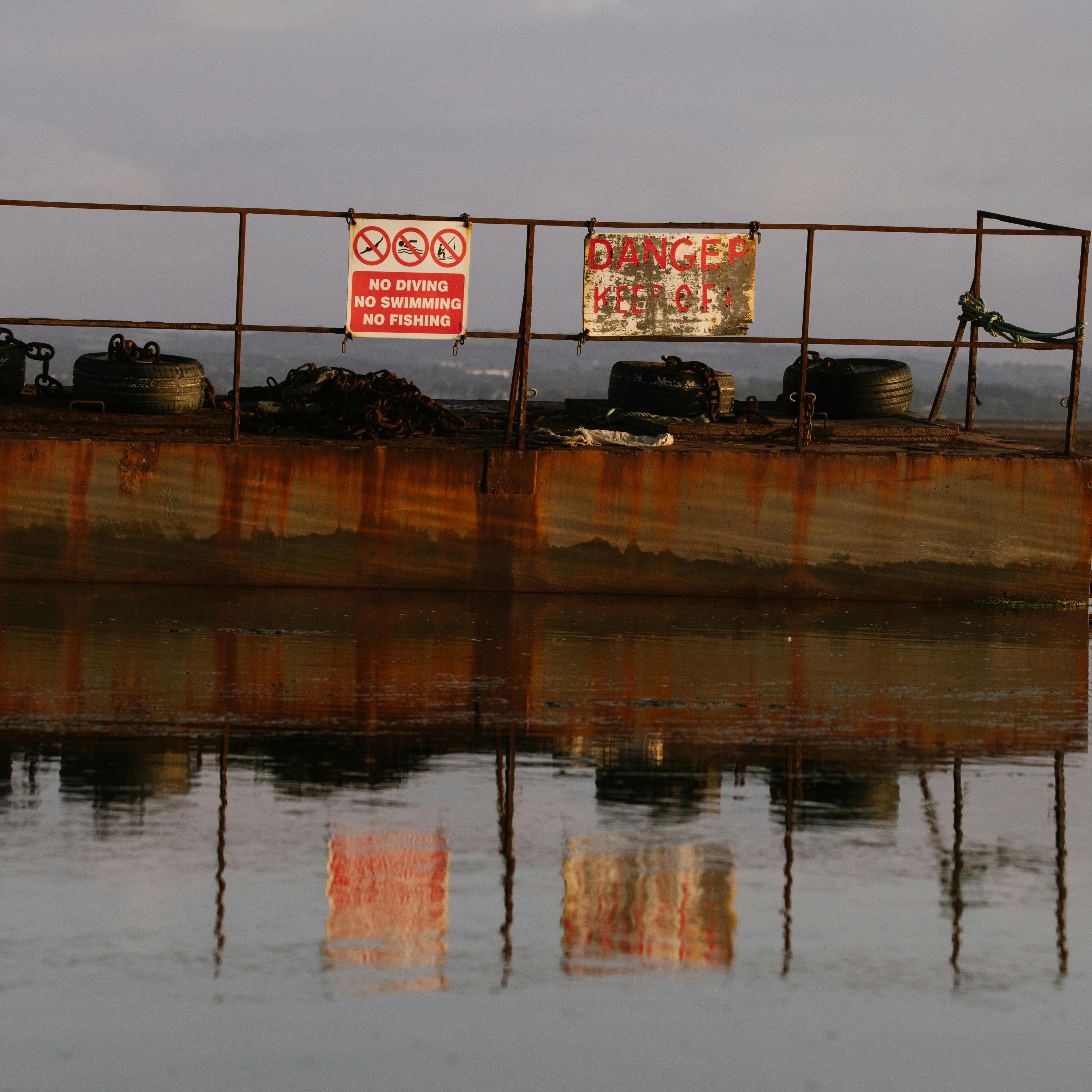 Rusty Warning Signs · Free Stock Photo