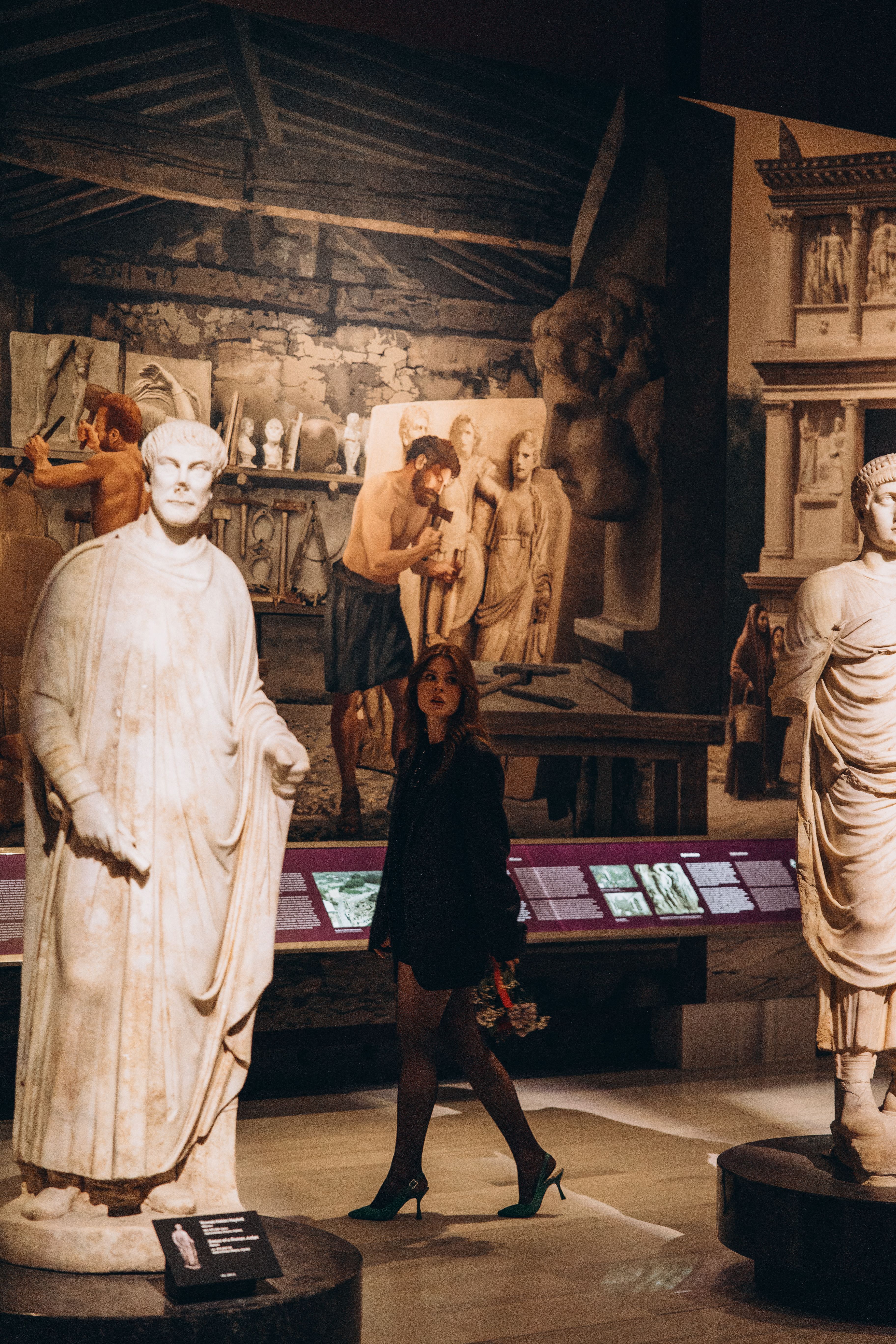 A Woman Visiting the Museum Exhibition · Free Stock Photo