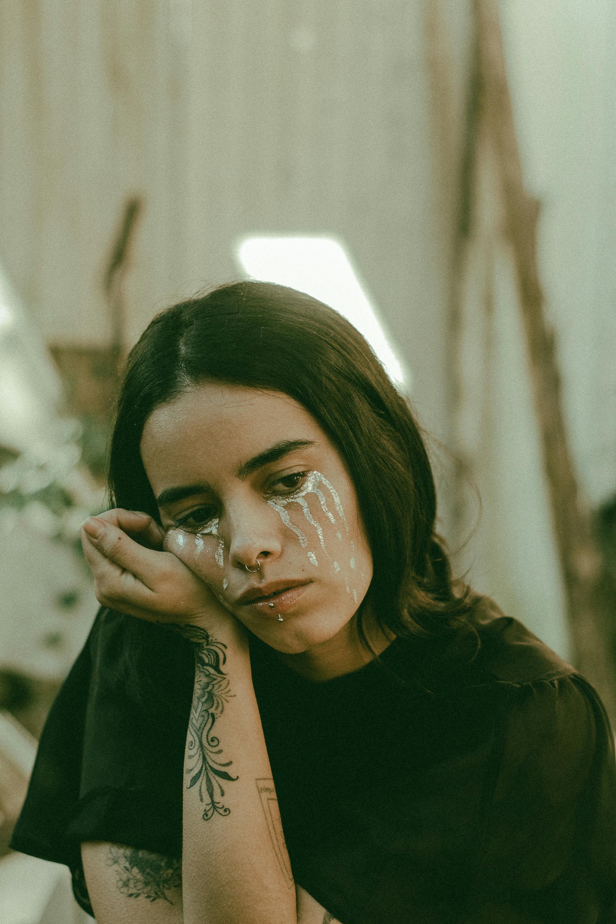 Sad Woman with Tattoos · Free Stock Photo