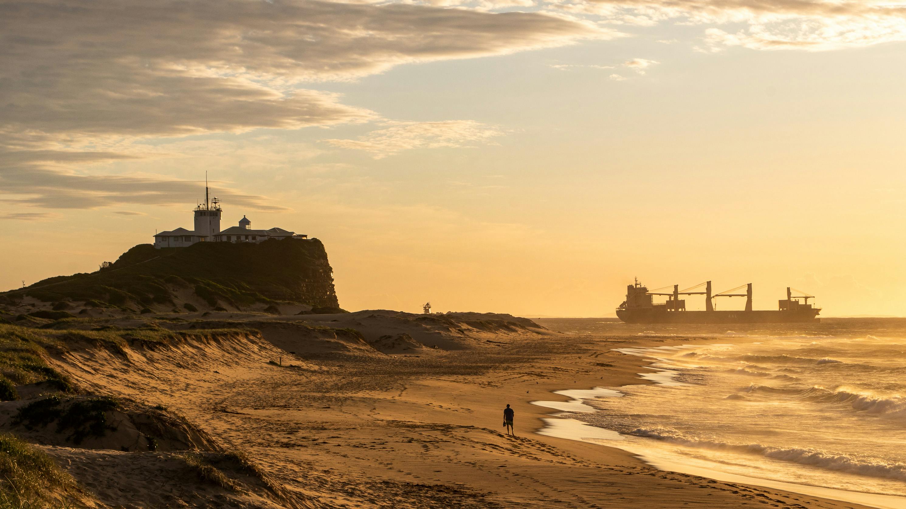 View of the Nobbys Beach and Nobbys Lighthouse at Sunset in Newcastle ...