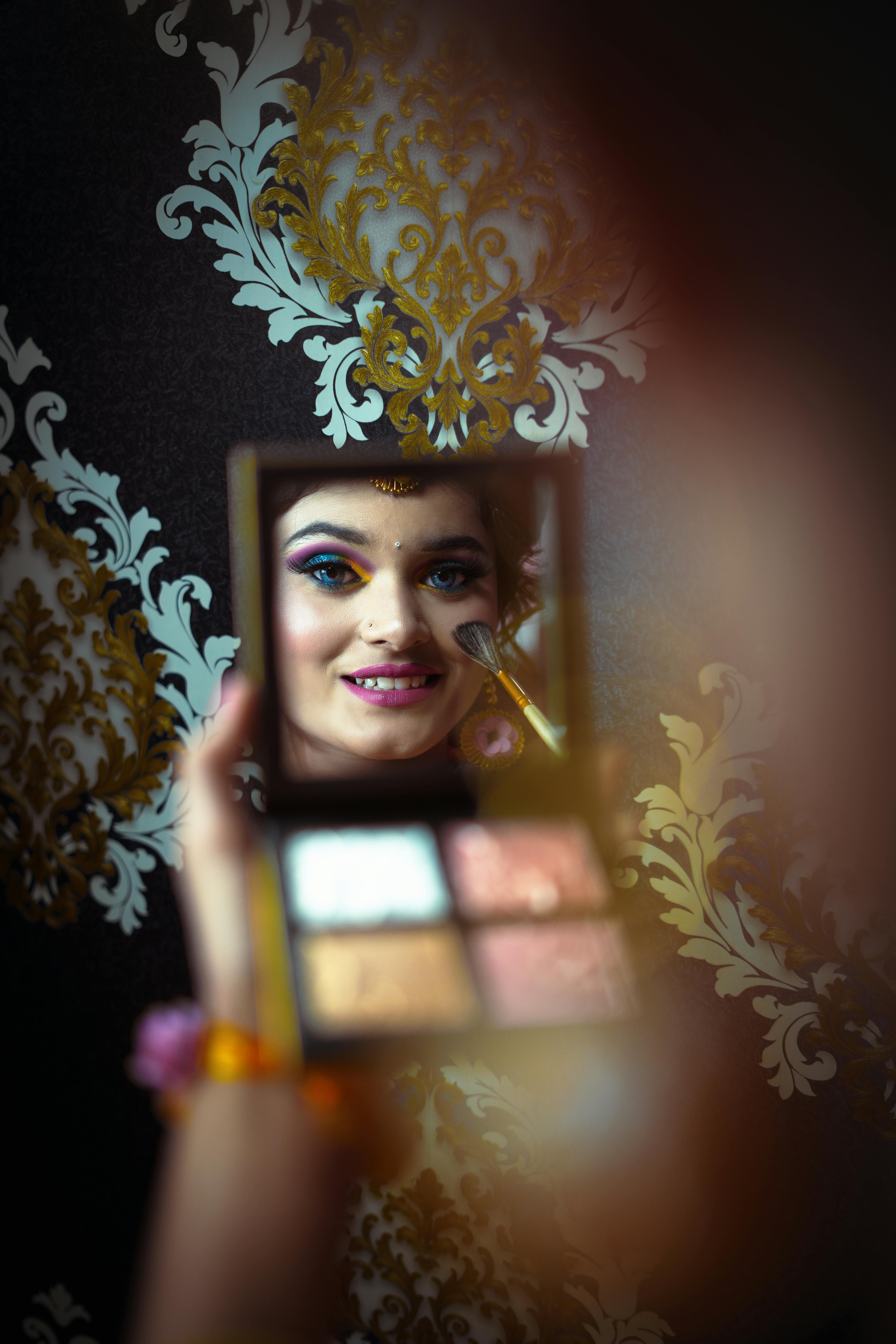 Reflection of Woman Doing Makeup · Free Stock Photo