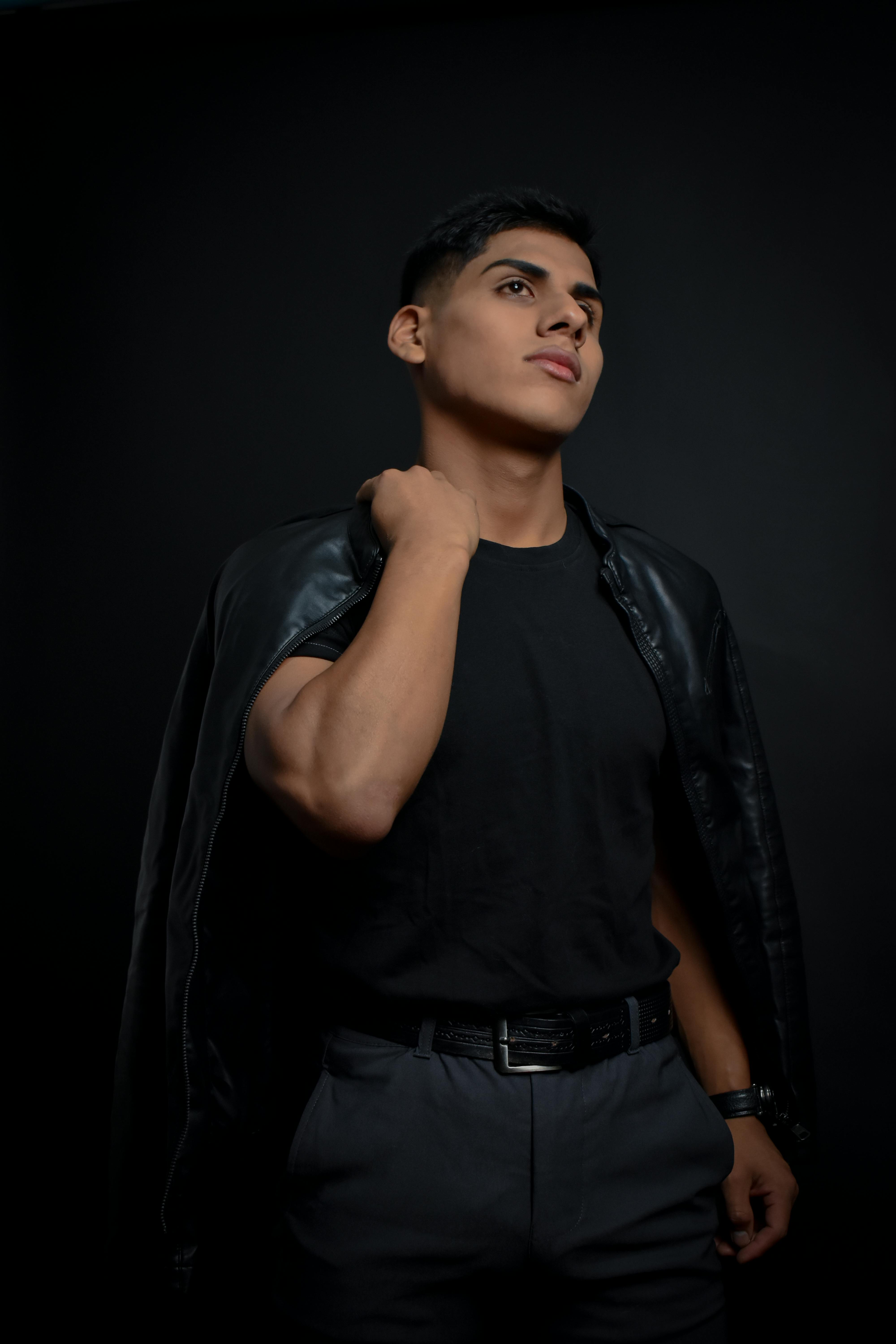 Man in Colorful Jacket Posing in Violet Background · Free Stock Photo