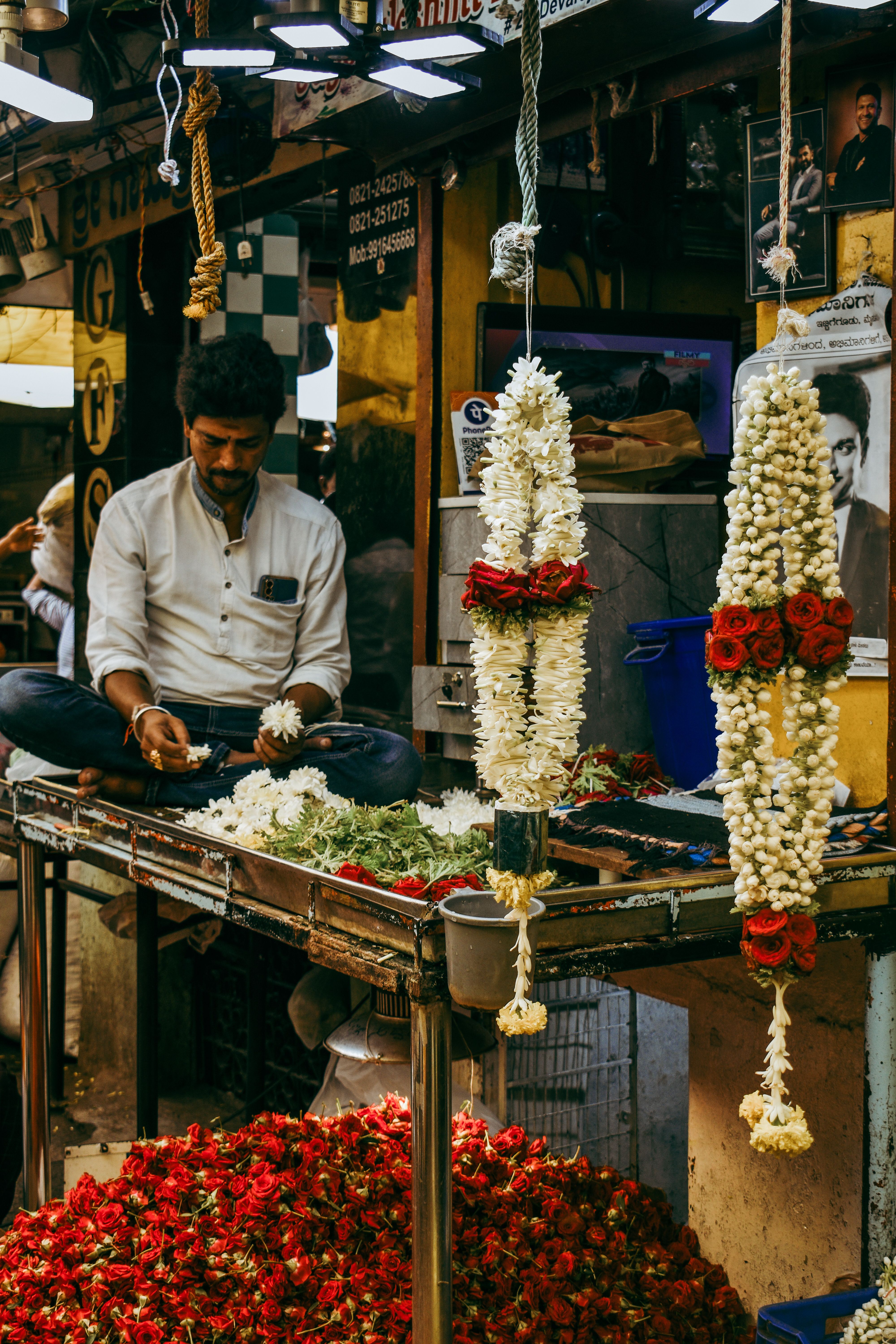 Man Making Decorations from Flowers · Free Stock Photo