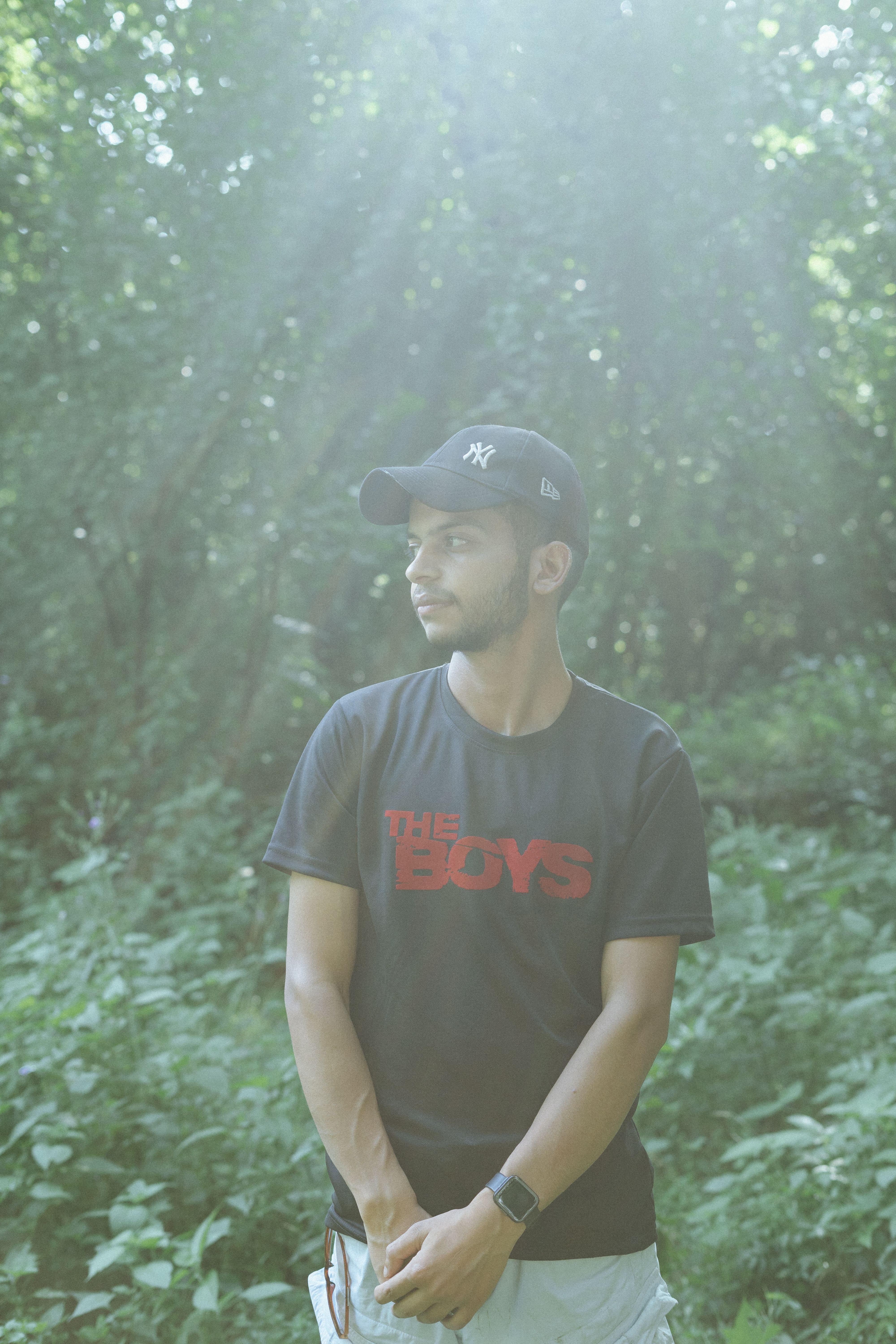 Man Standing in a Forest in Sunlight · Free Stock Photo