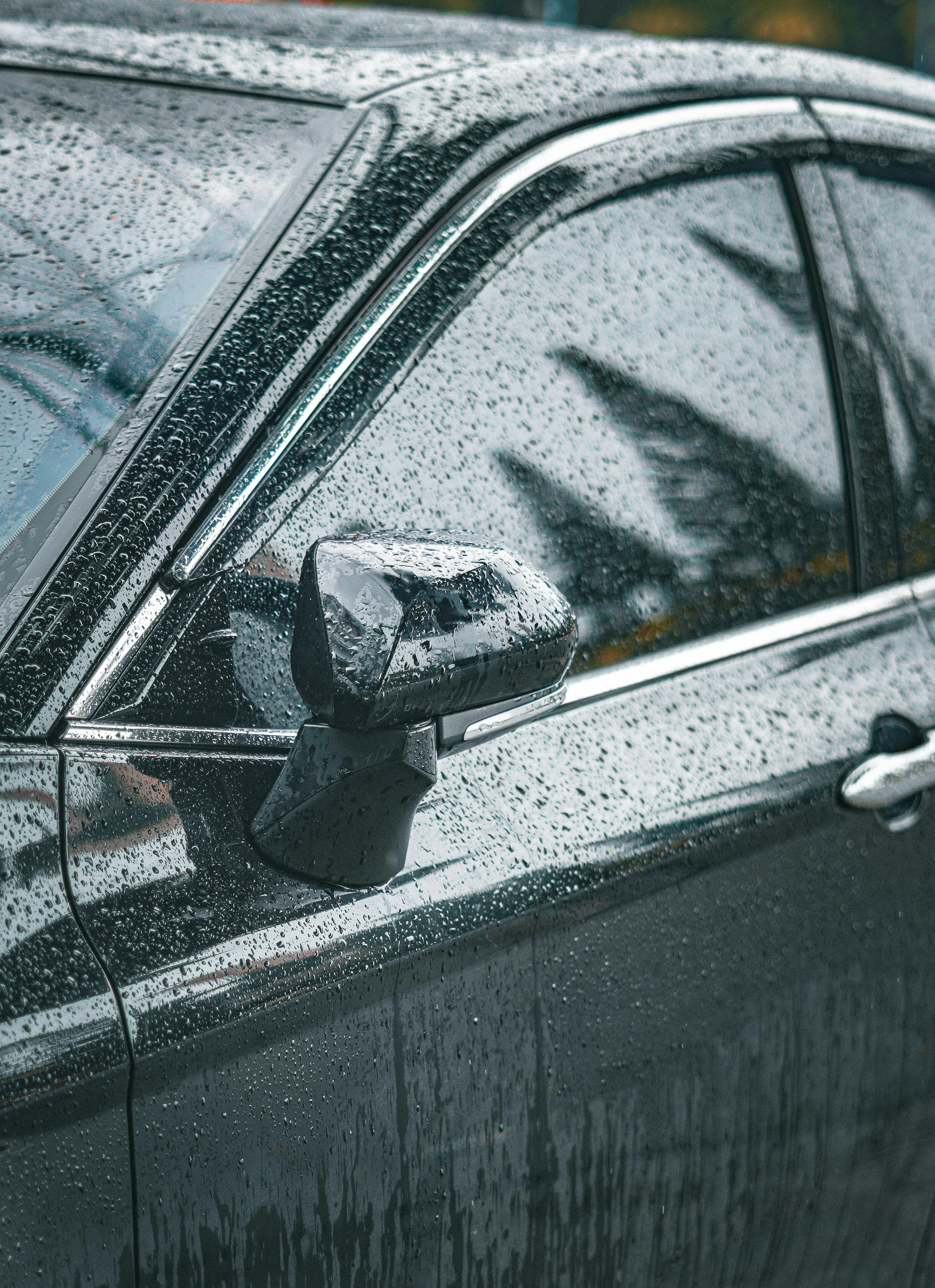 Reflection of a Woman from the Side Mirror of a Car · Free Stock Photo