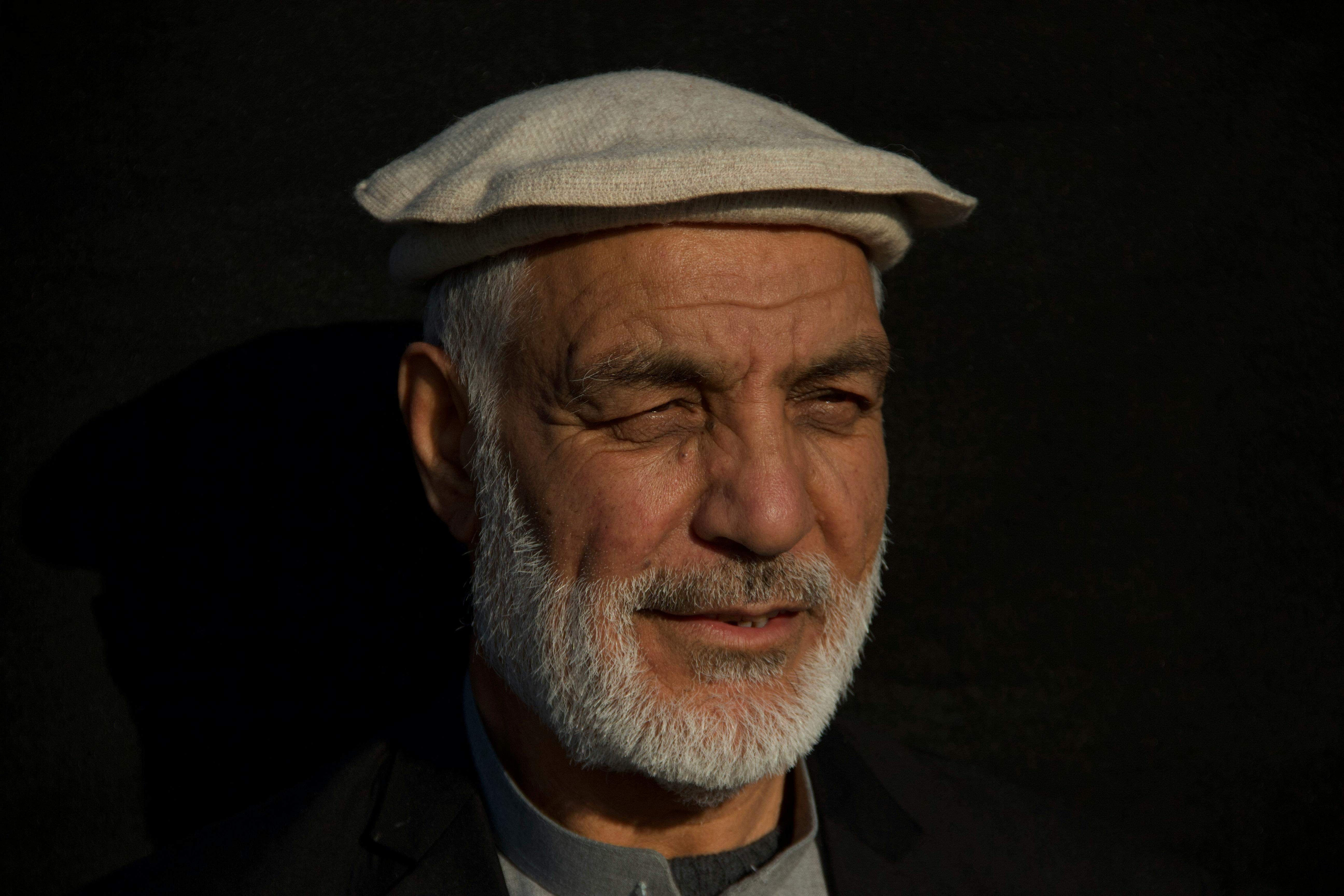 Portrait of a Senior Man Wearing a Flat Cap · Free Stock Photo
