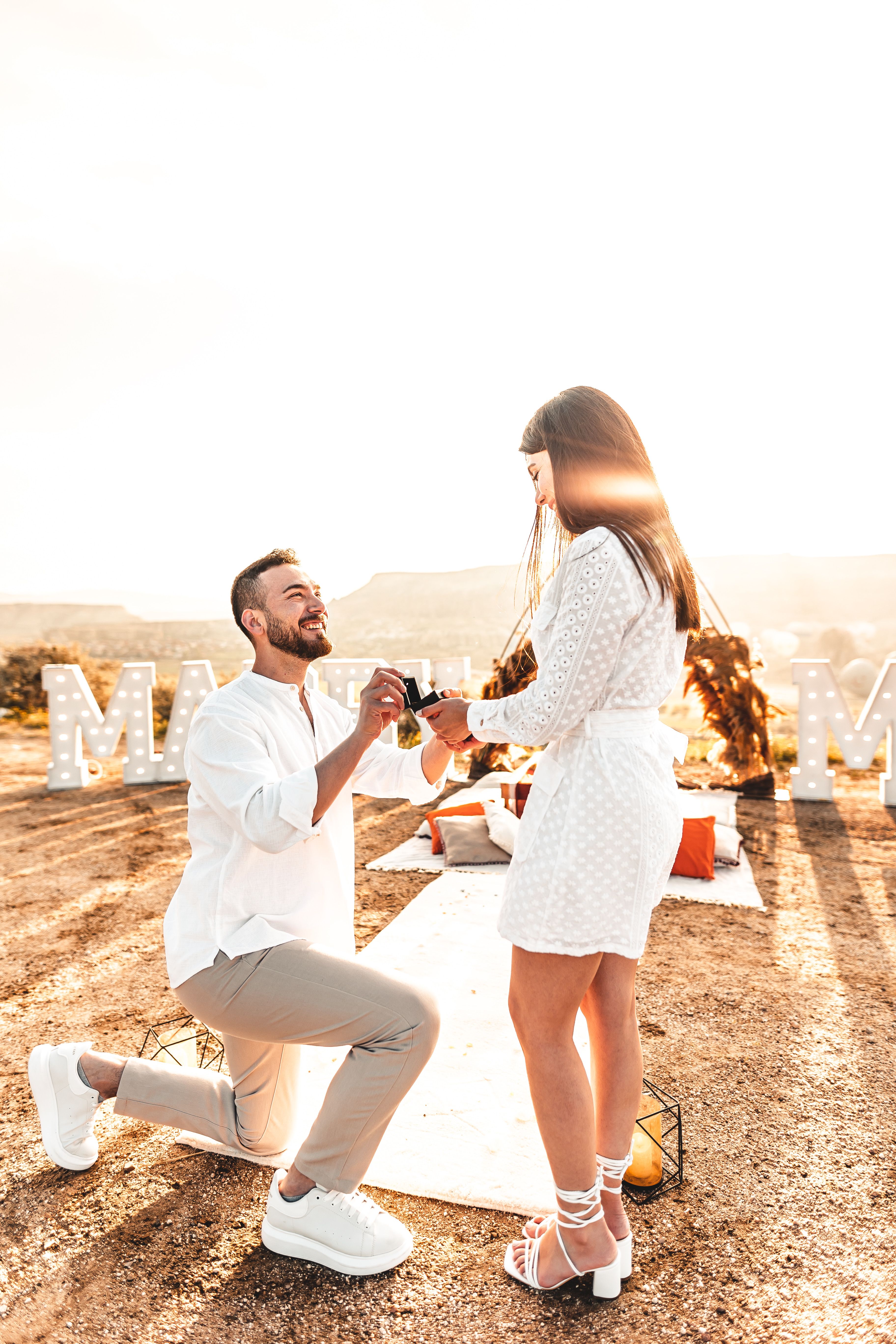 A Man Proposing to a Woman Outside at Sunset · Free Stock Photo