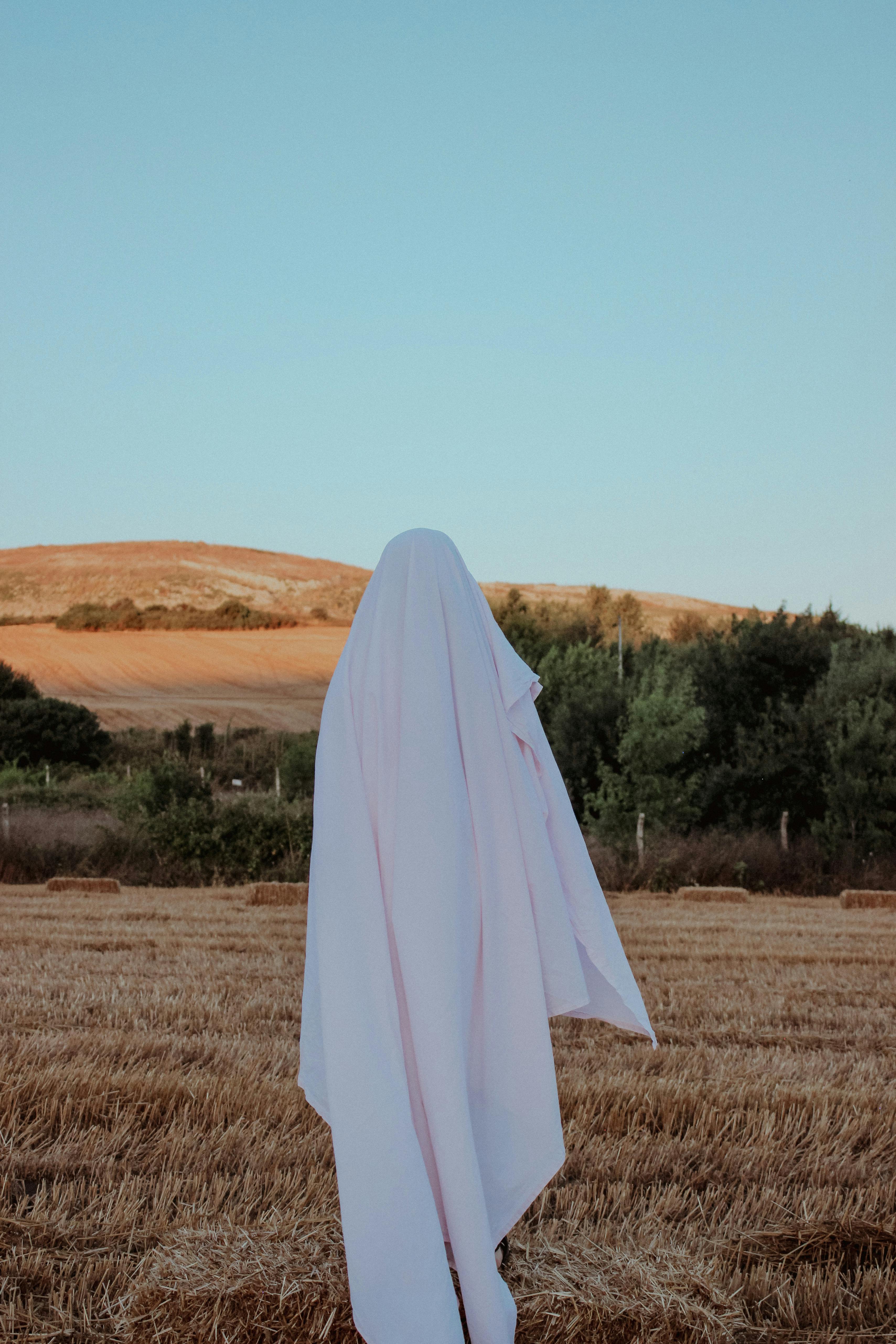 Ghost Walking on Rural Field · Free Stock Photo