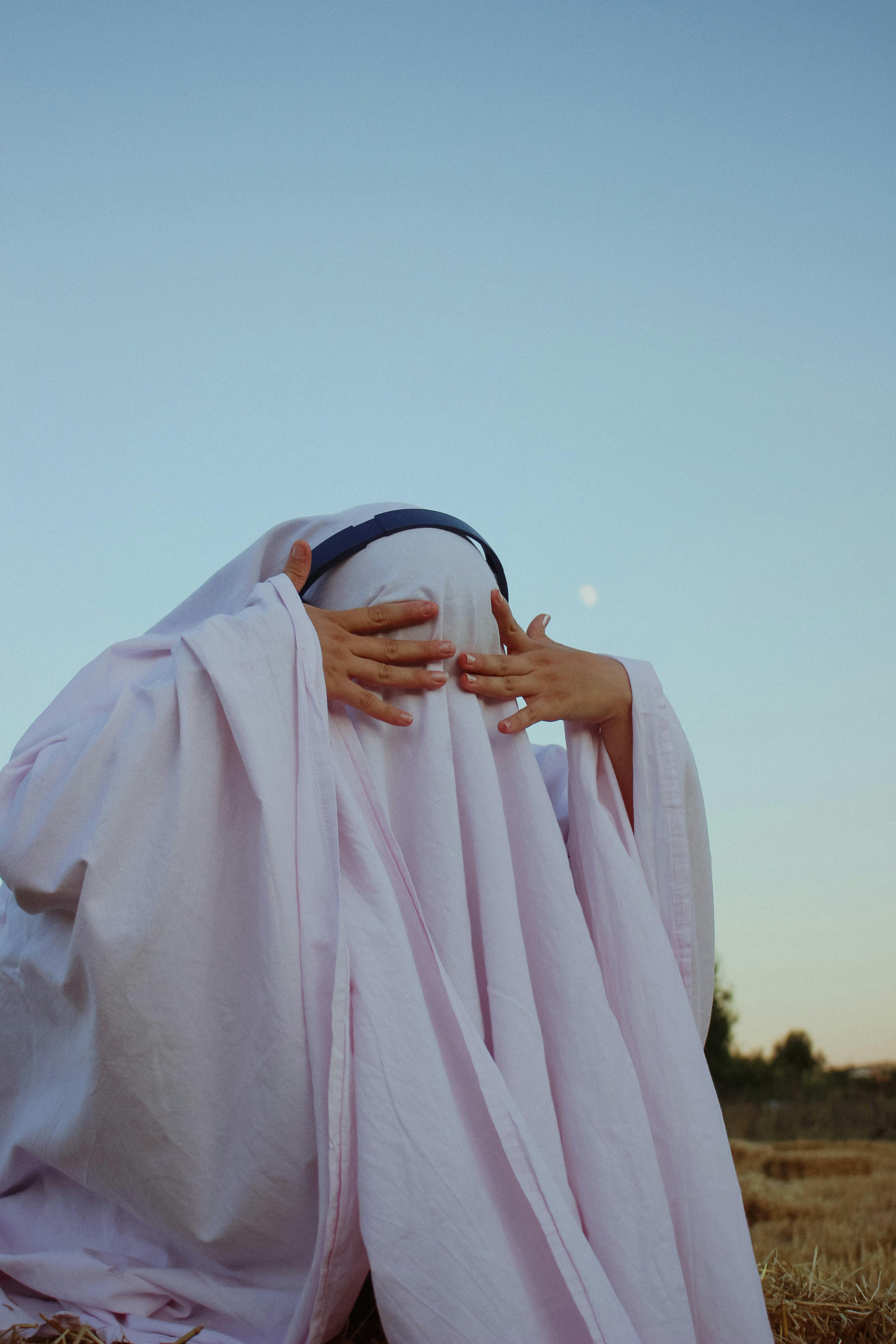 Ghosts on Rural Field at Dusk · Free Stock Photo
