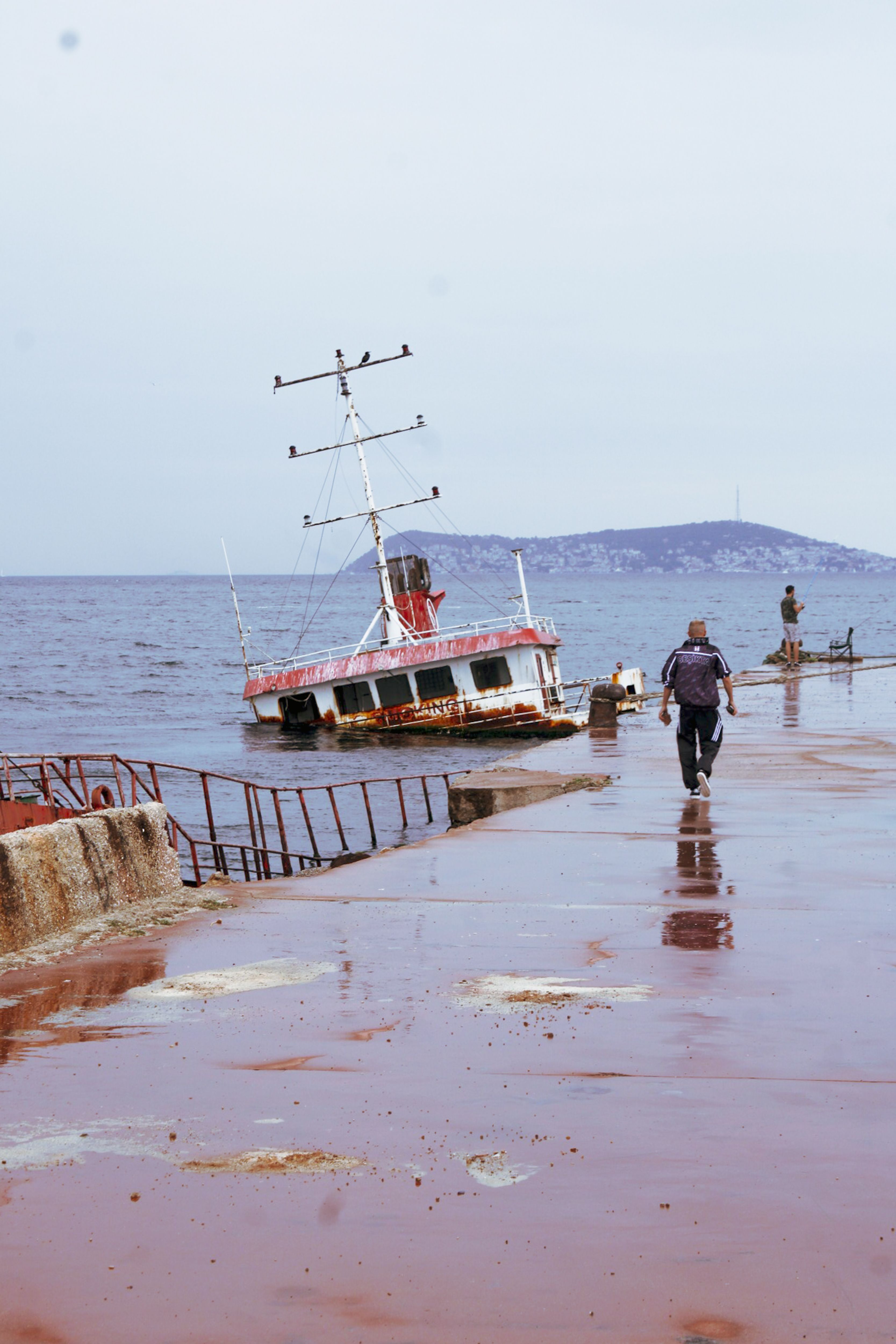 Sunken Vessel on Sea Shore · Free Stock Photo