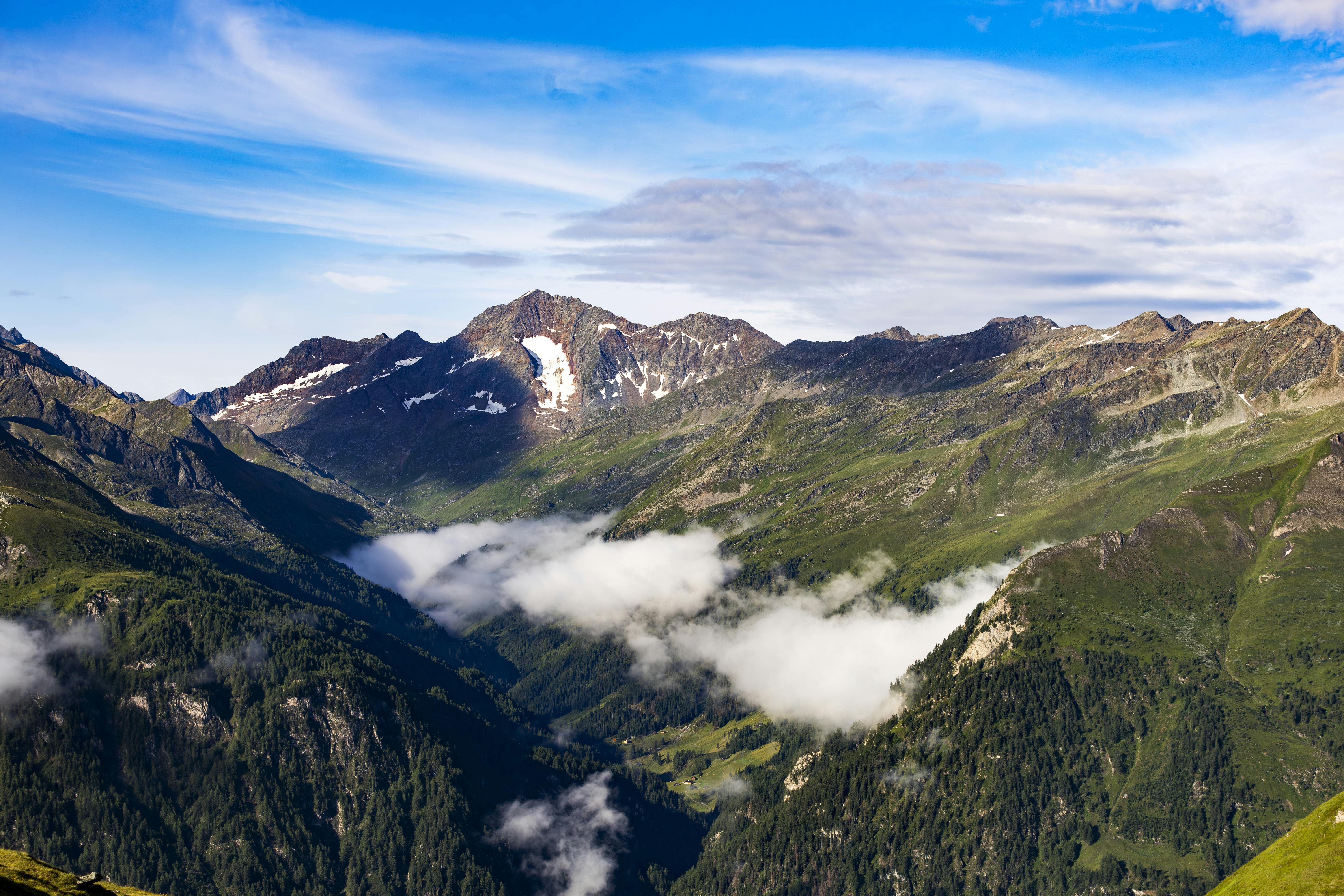 Snow Cap Mountain Under Nimbus Clouds · Free Stock Photo
