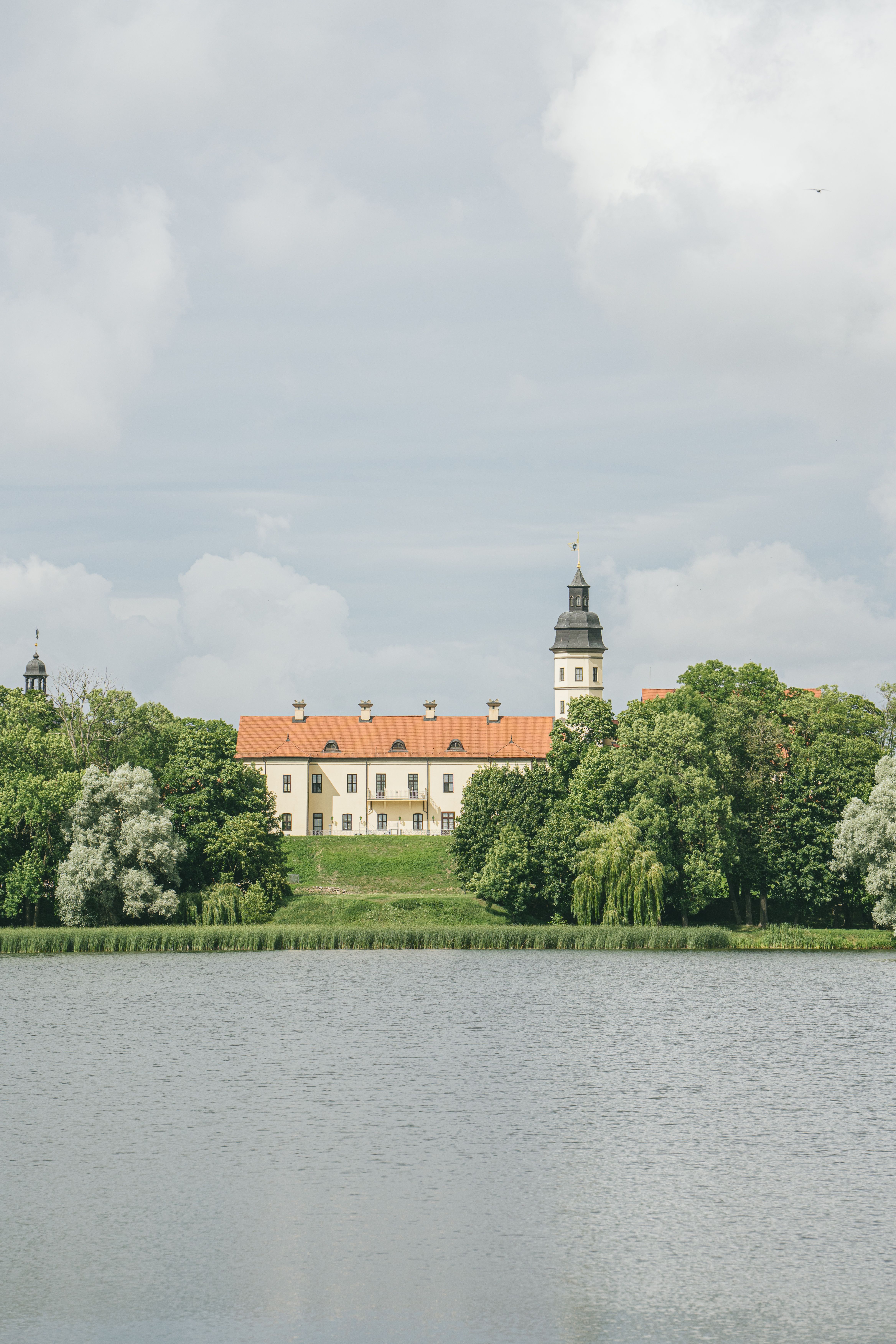 View of a Body of Water, Trees and a Castle · Free Stock Photo