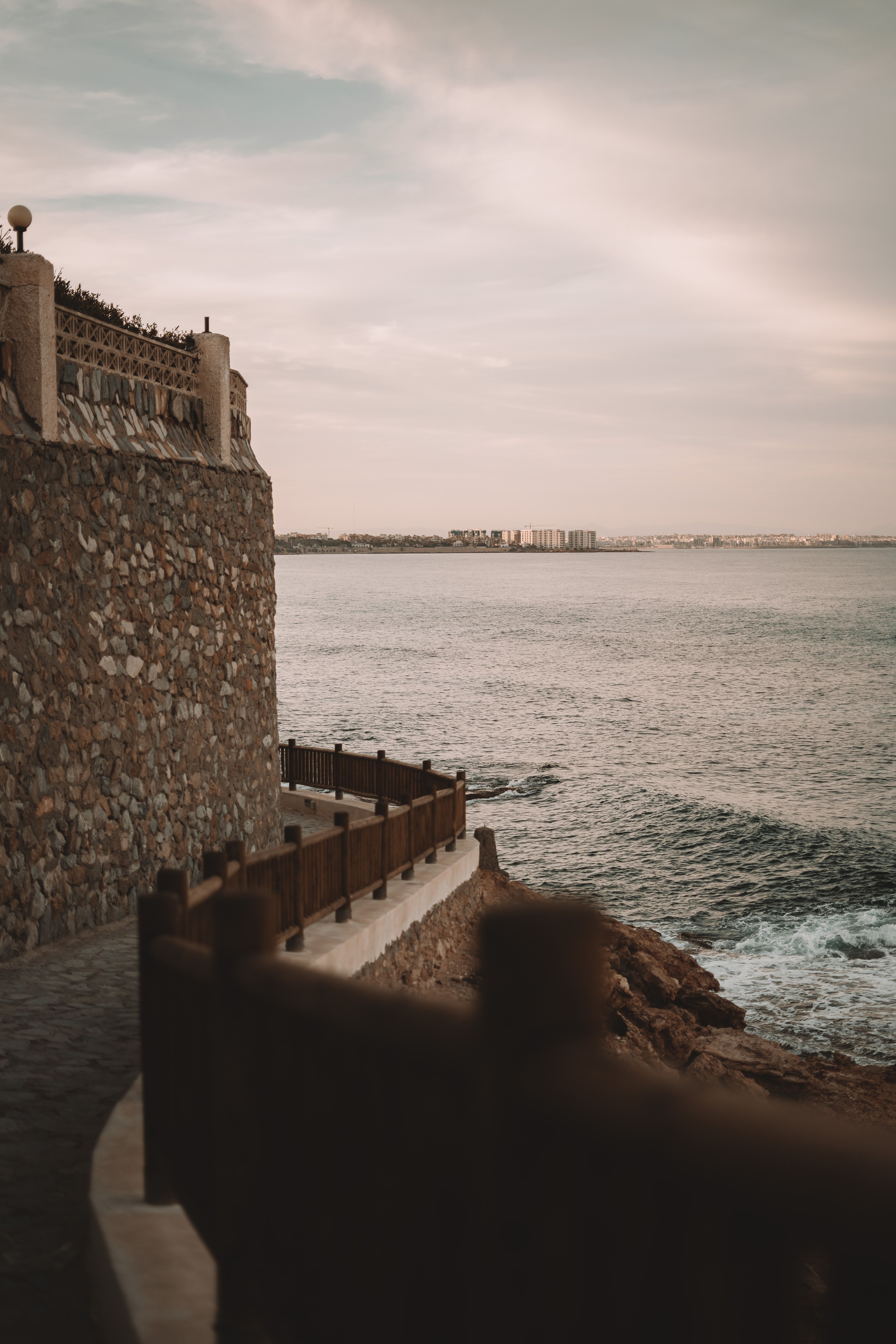 Stone Fortification Wall on Sea Coast · Free Stock Photo