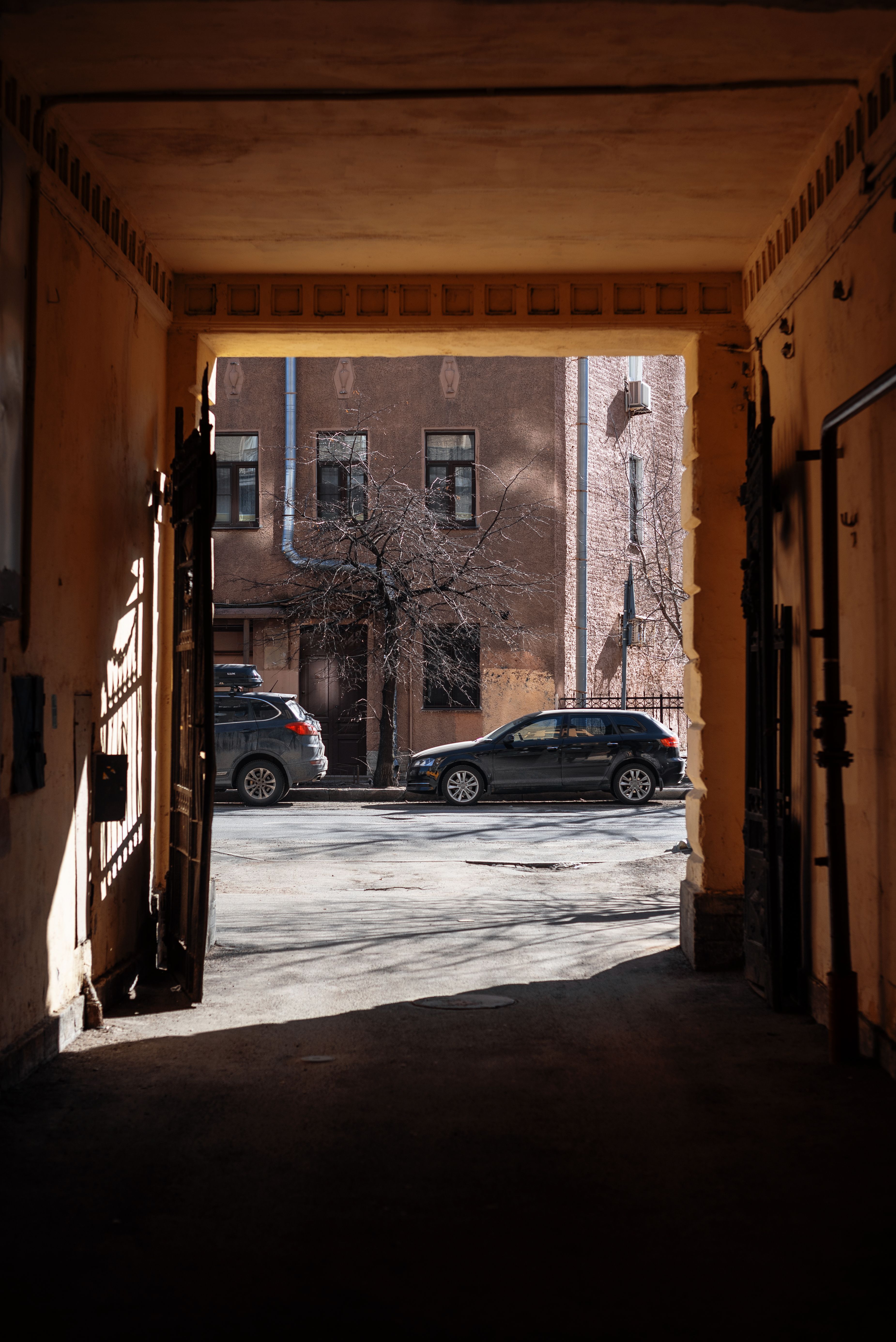 Cars on Street Seen from Passage · Free Stock Photo