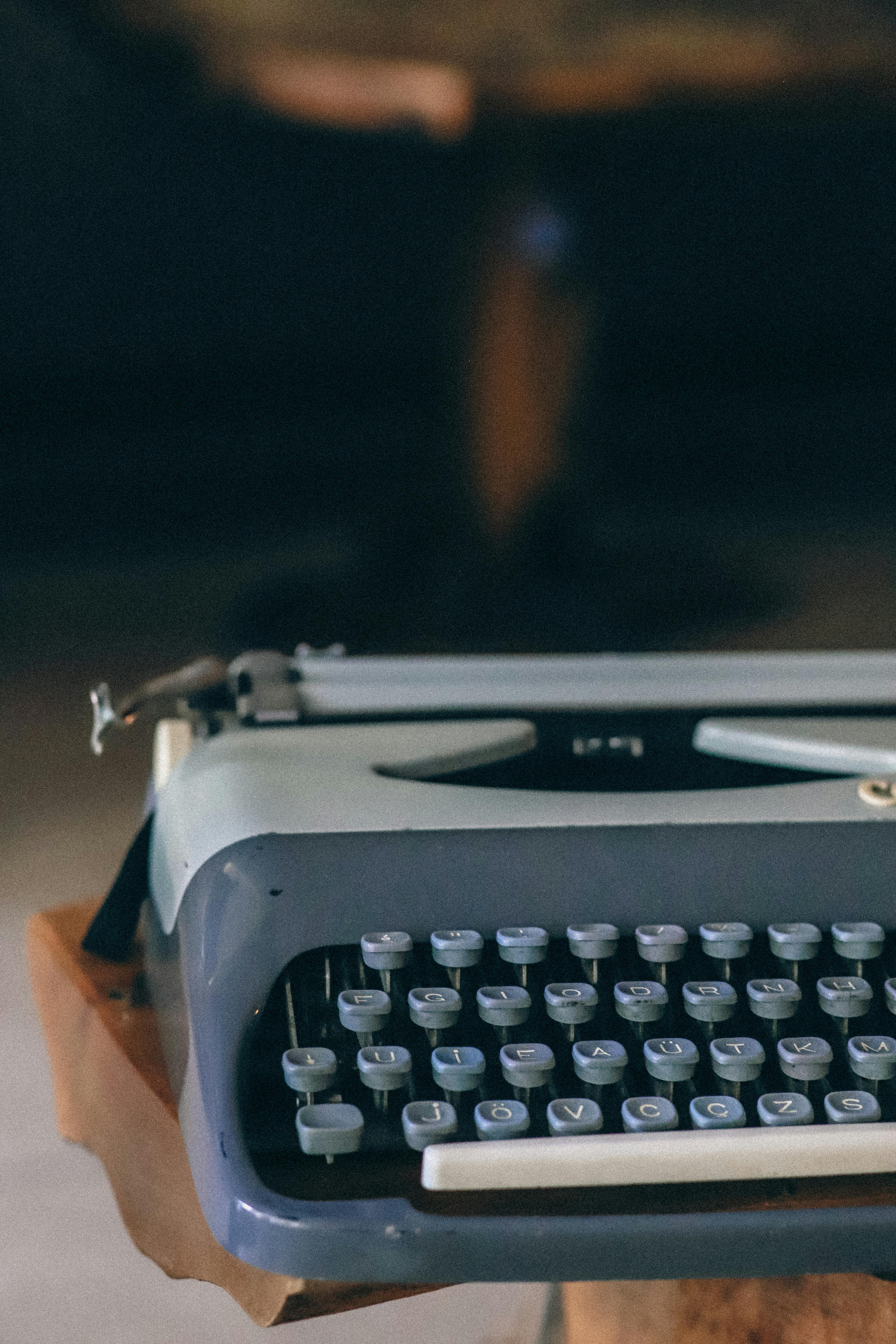 Classic Black Typewriter on Brown Wooden Desk · Free Stock Photo