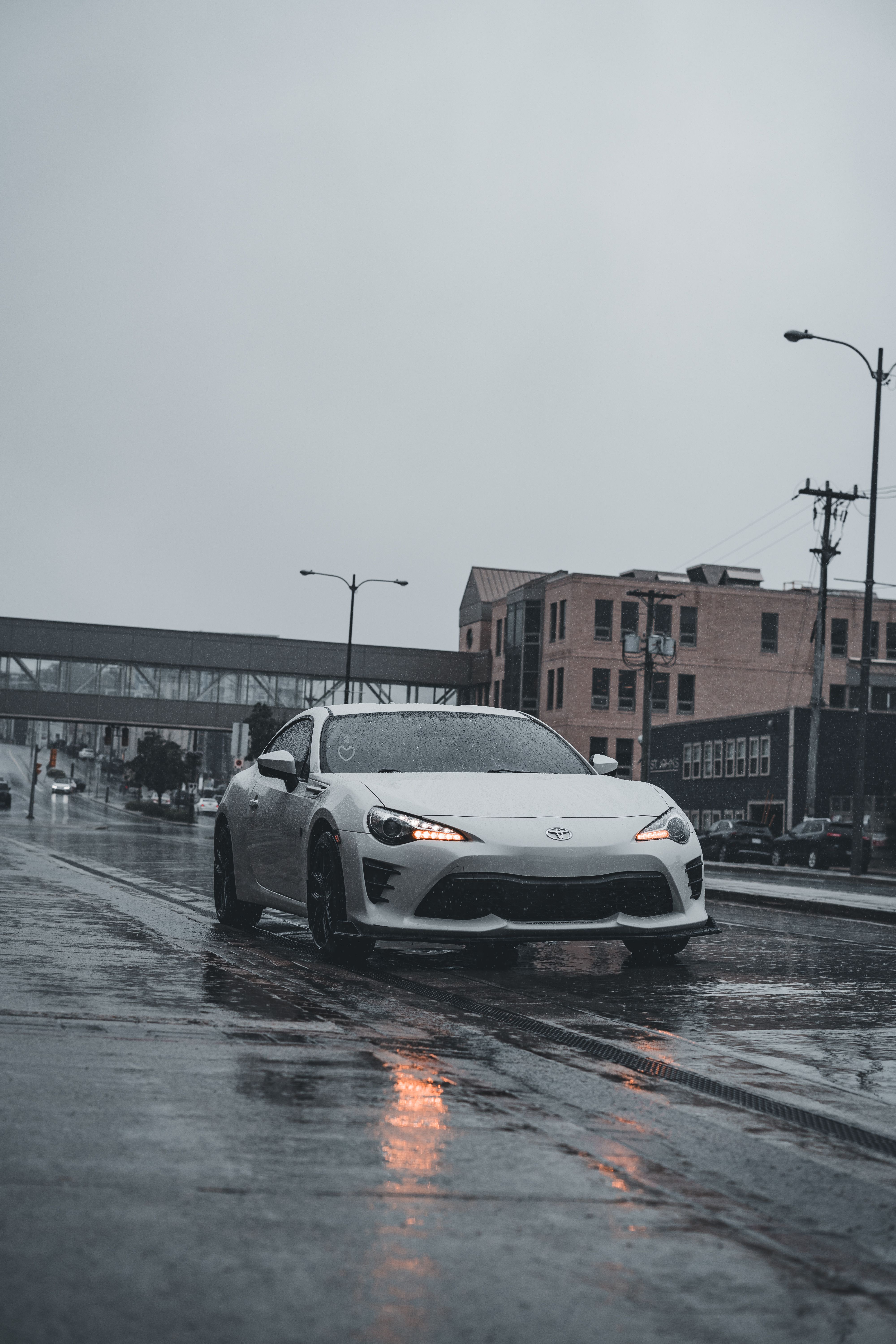 White Toyota on Street in Rain · Free Stock Photo