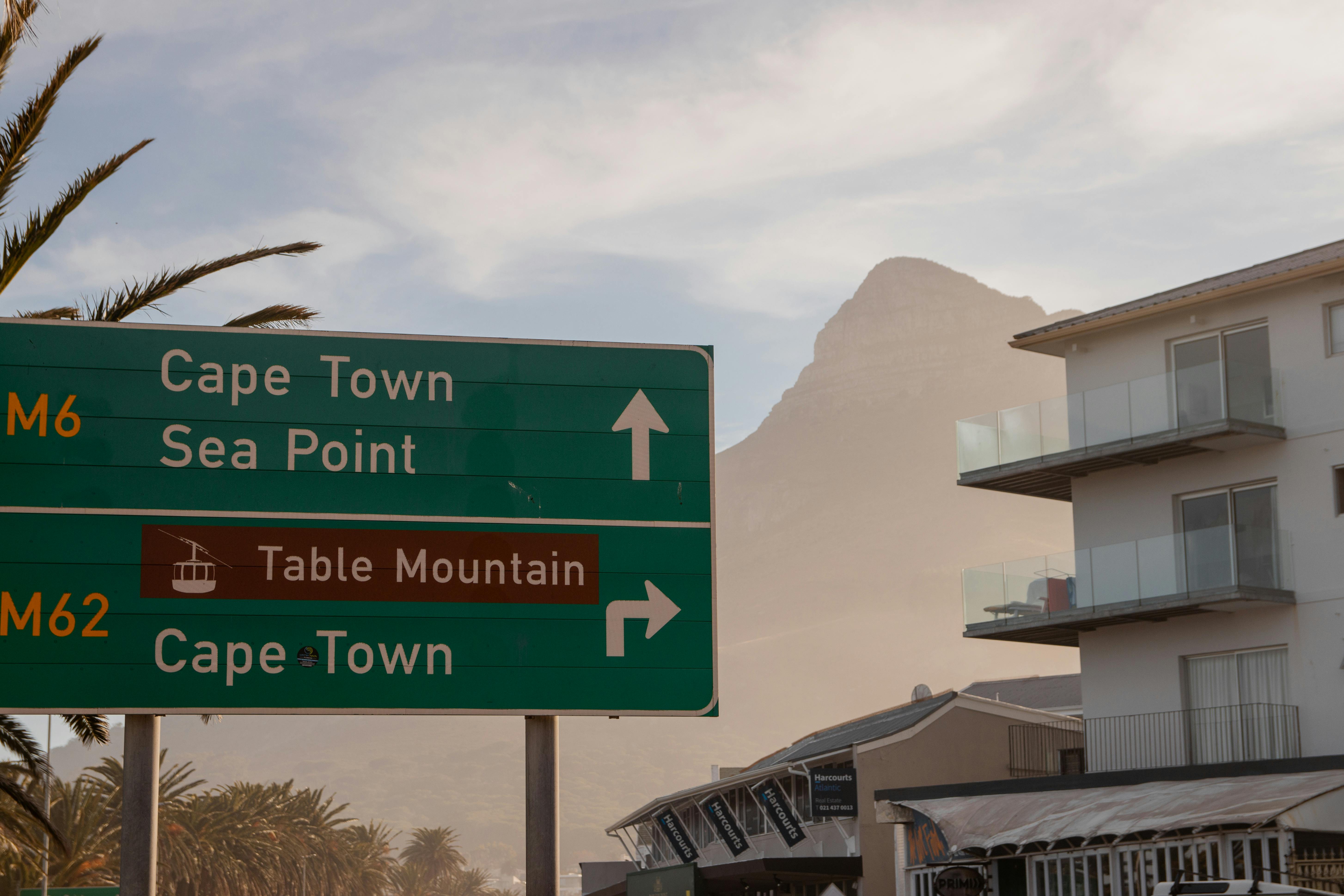 Signpost with Table Mountain in the Background · Free Stock Photo