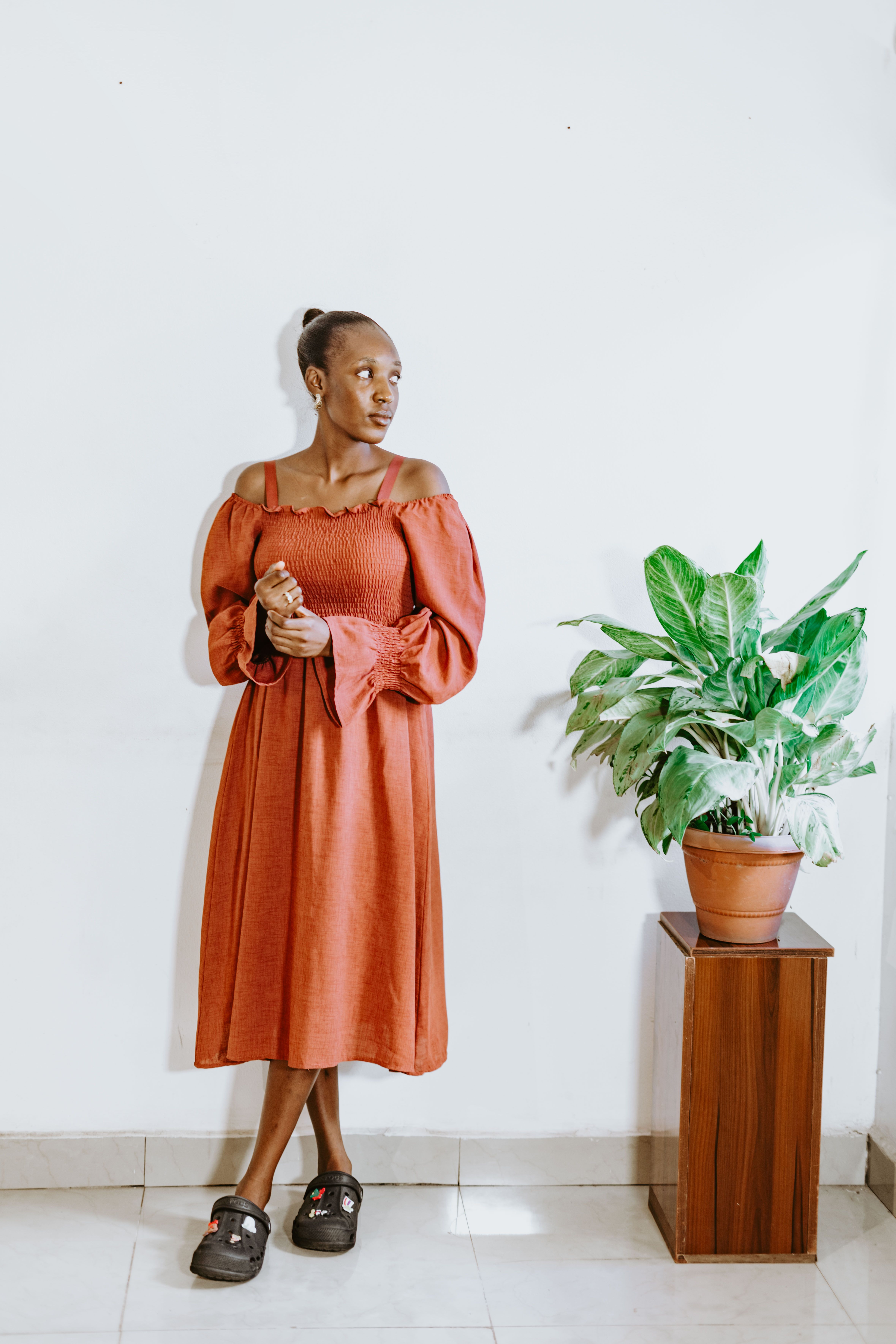 Woman in a Red Dress and Black Crocs · Free Stock Photo