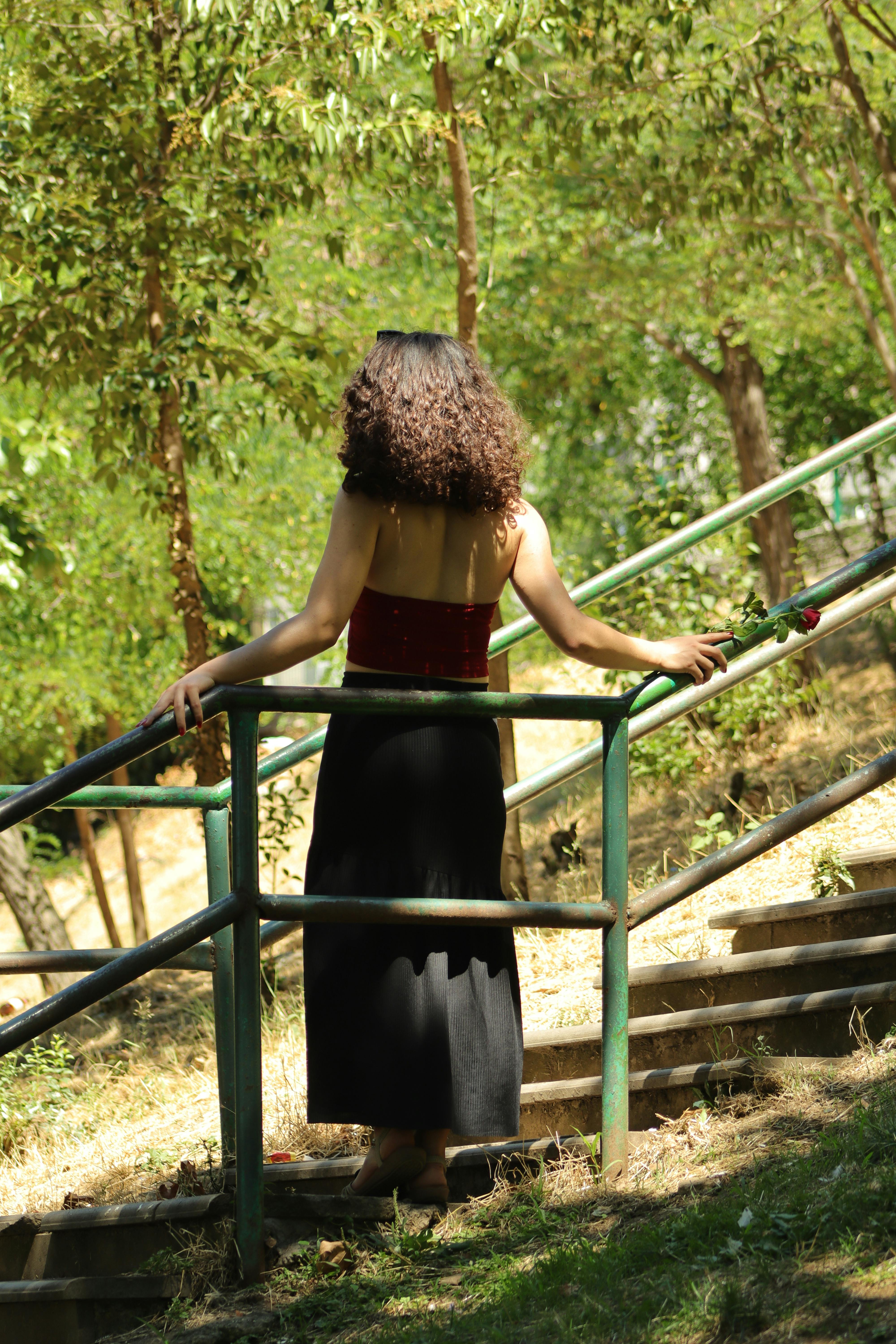 Woman Leaning against Railing · Free Stock Photo