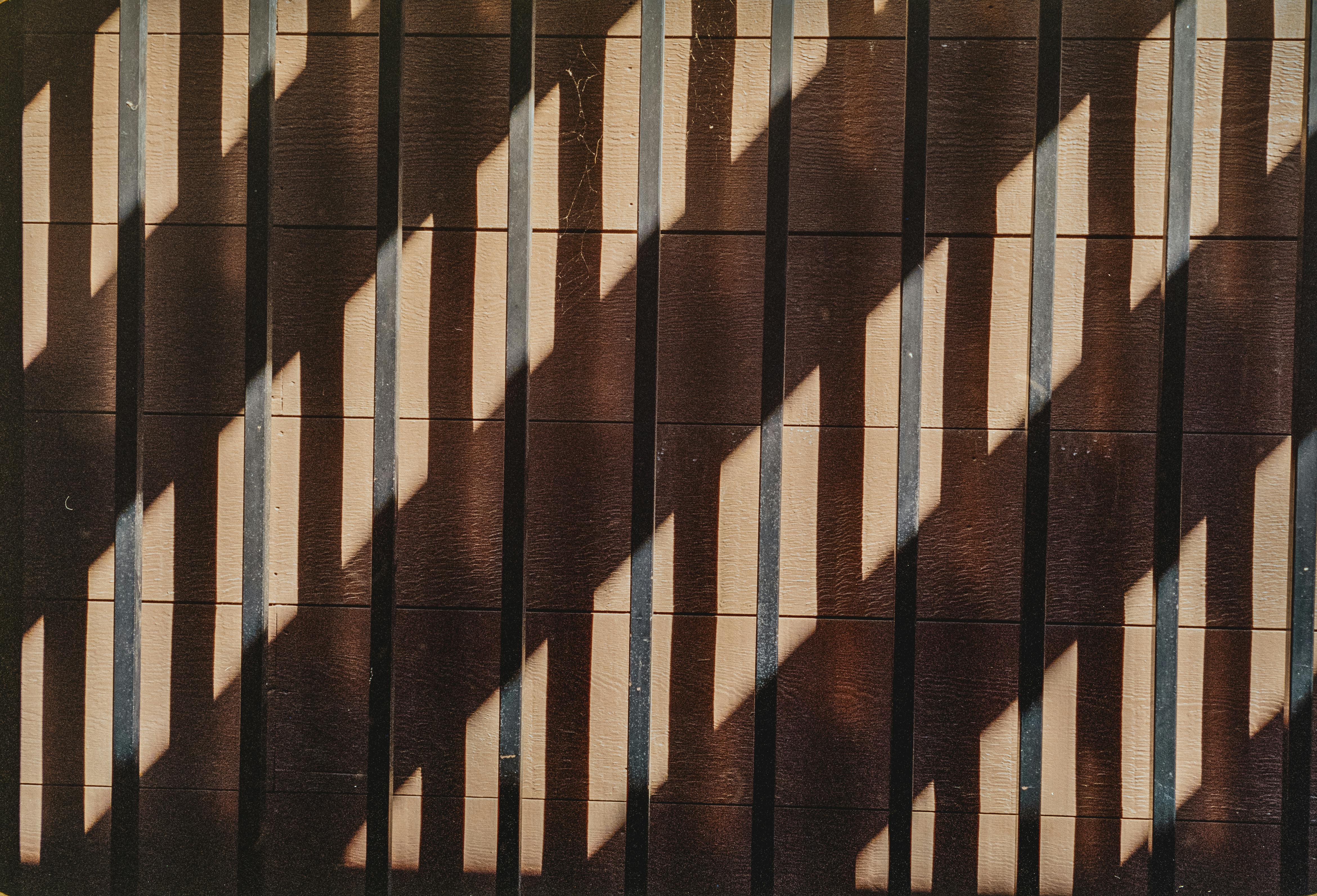Shadows on Building Wall · Free Stock Photo