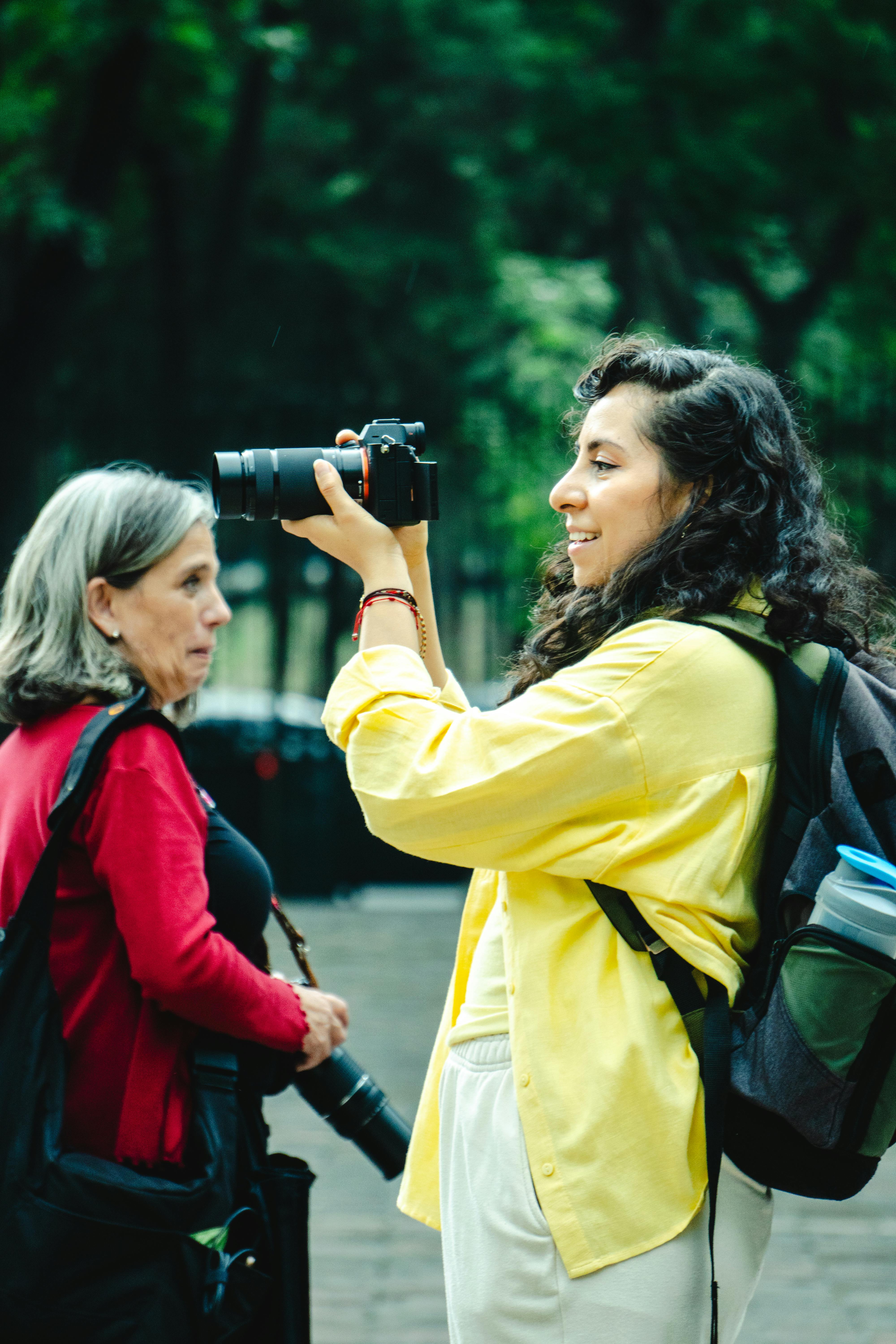 Women with Cameras in Park · Free Stock Photo