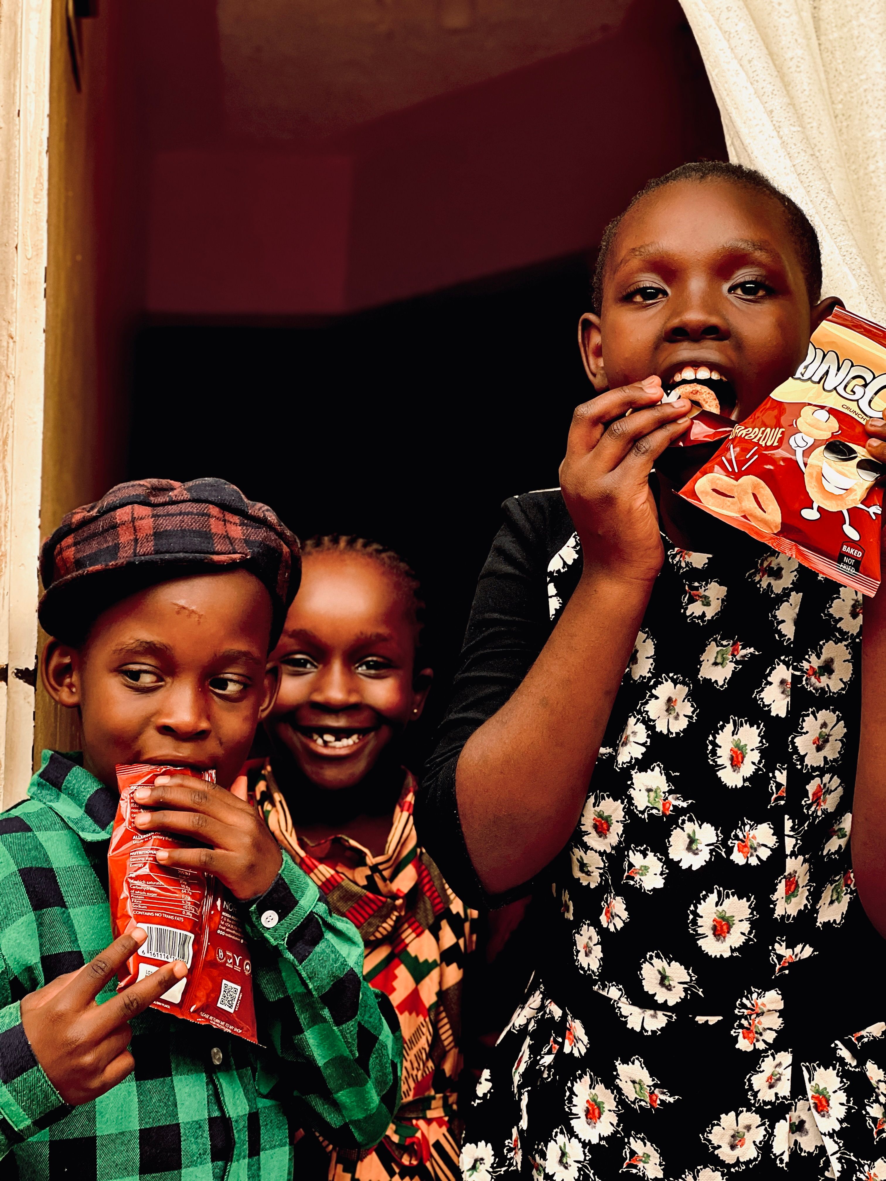 Boys and Girl Eating Chips · Free Stock Photo