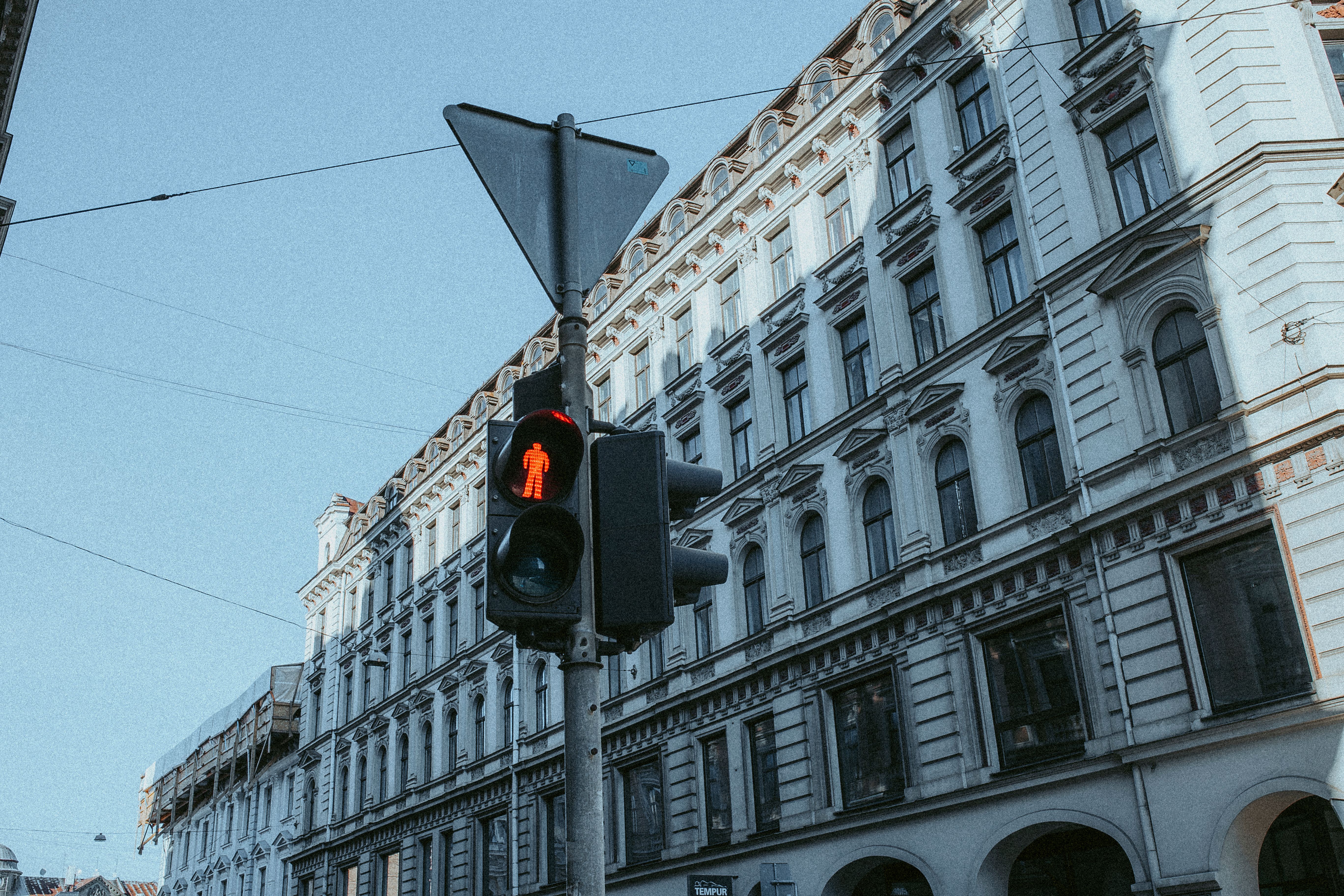 Street Light on Road Sign with Ornamented Building behind · Free Stock ...
