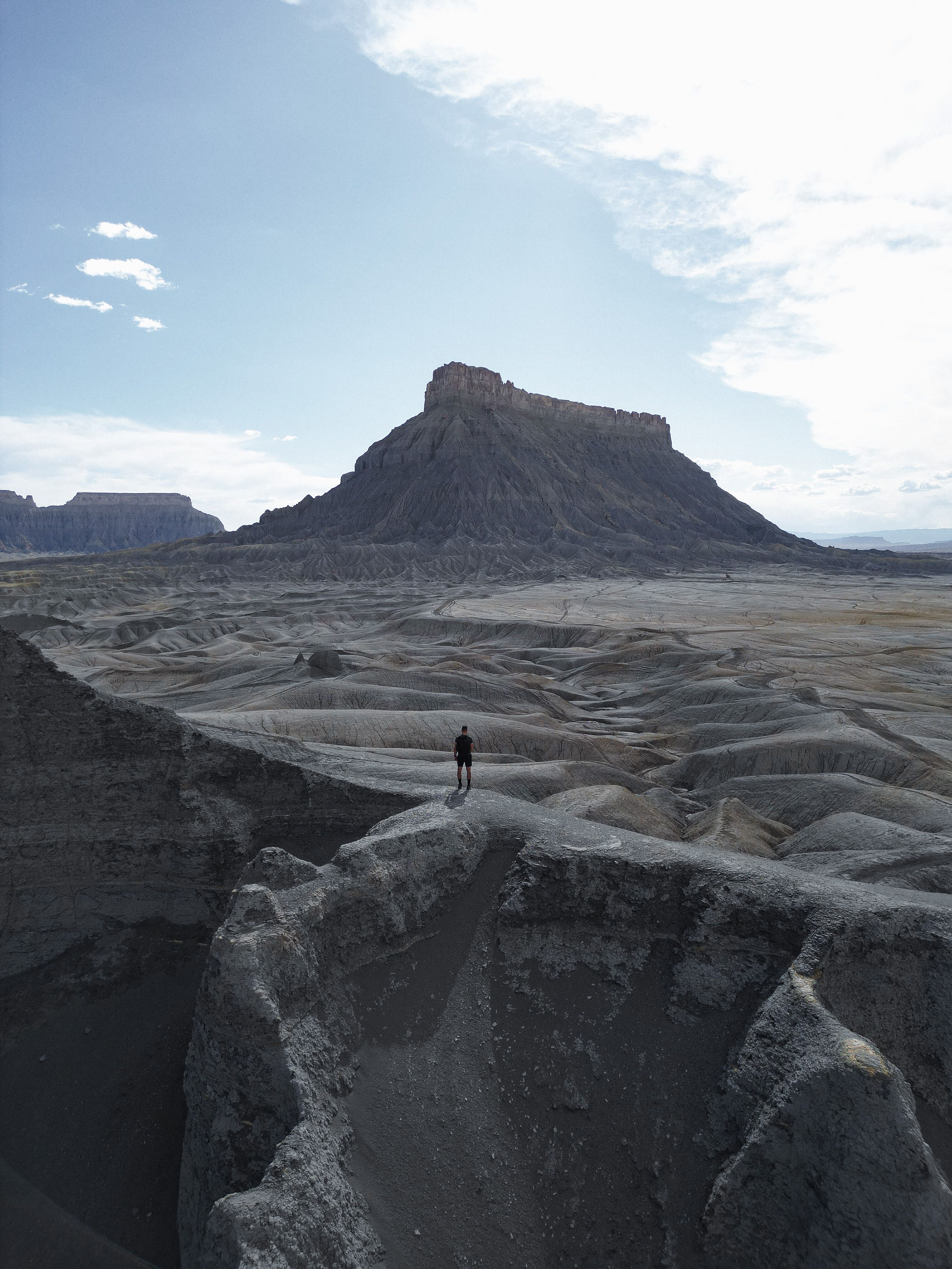 Man Looks at Factory Butte · Free Stock Photo