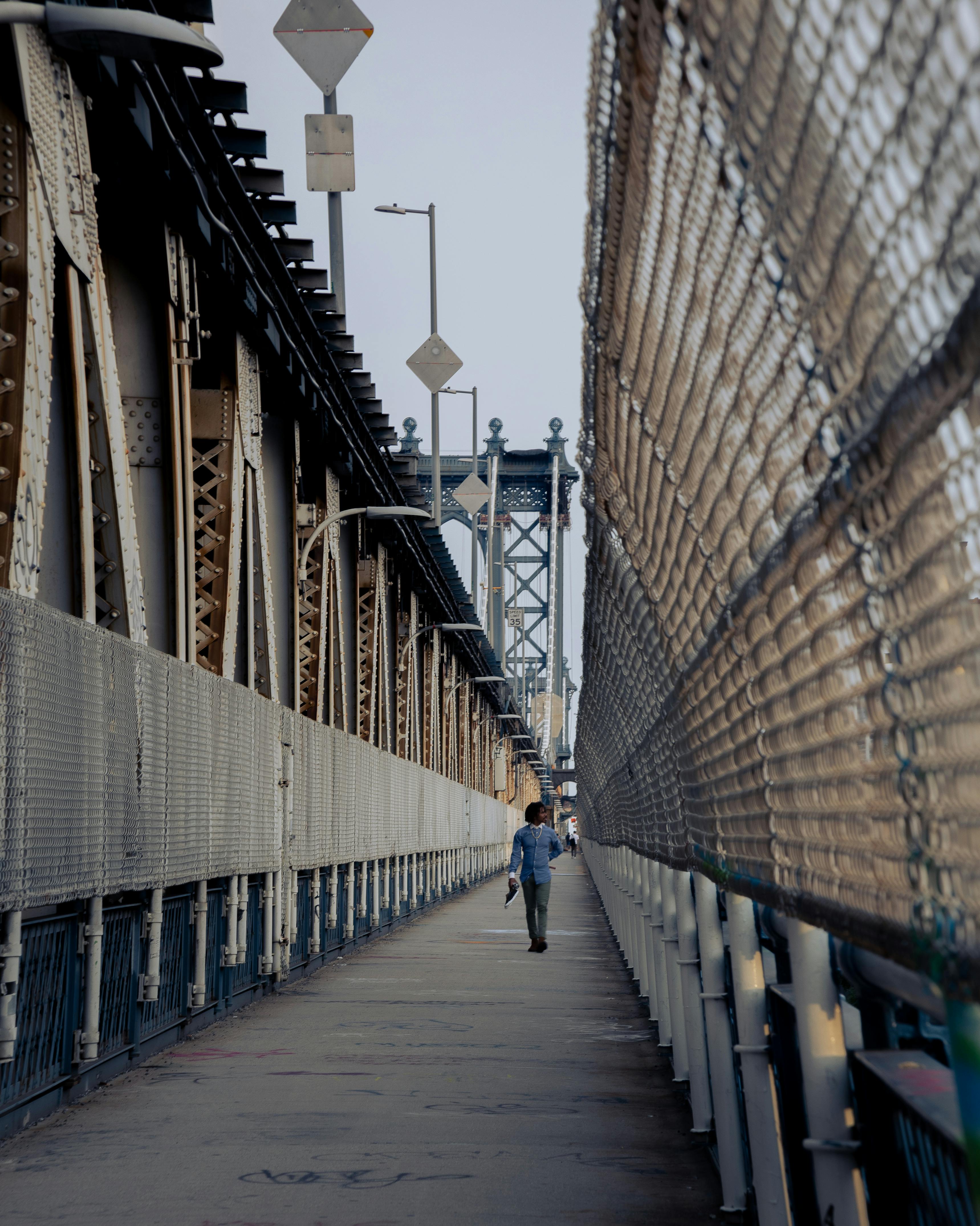 Person Walking on Sidewalk on Manhattan Bridge · Free Stock Photo