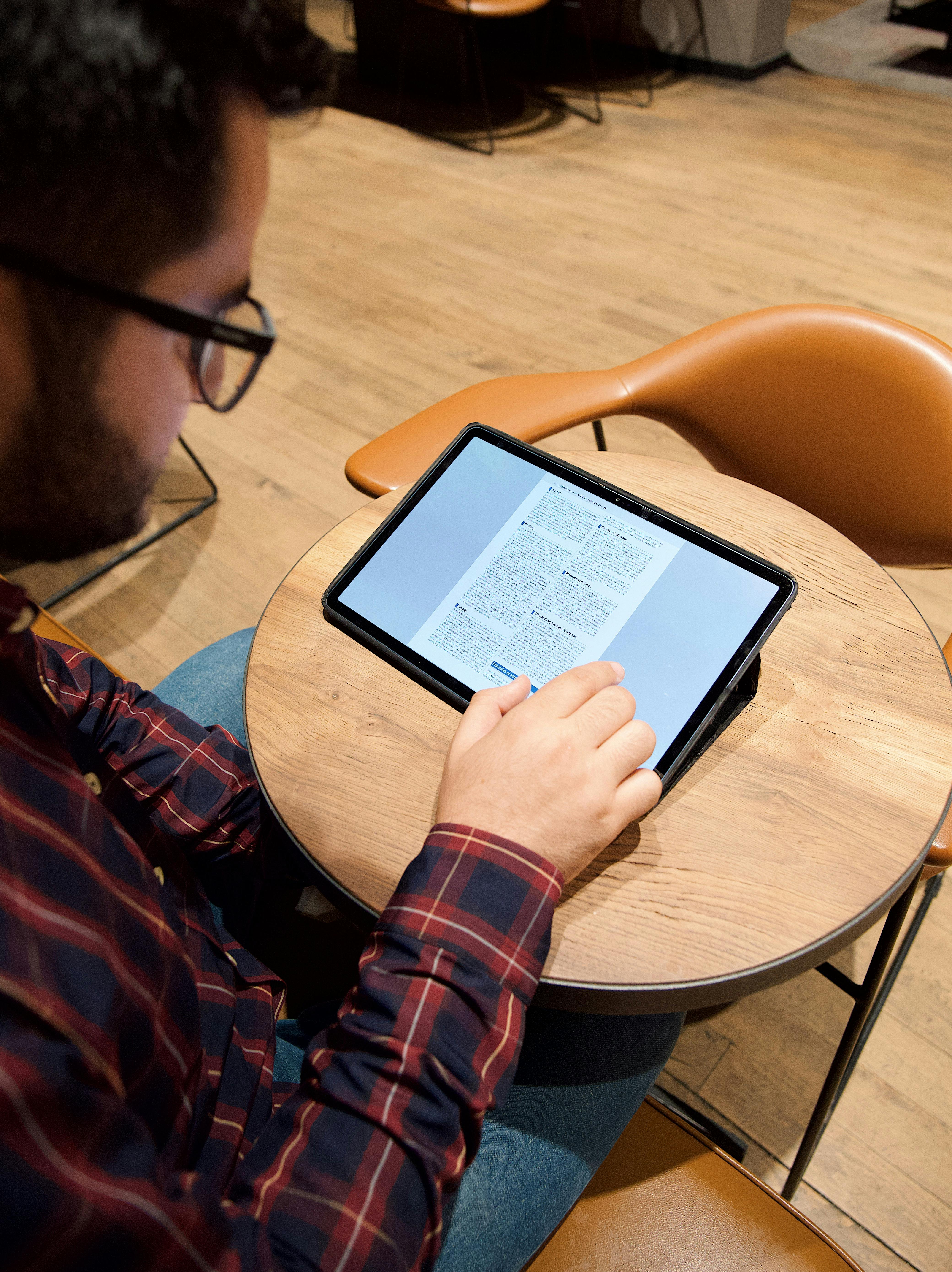 Man Using a Tablet · Free Stock Photo