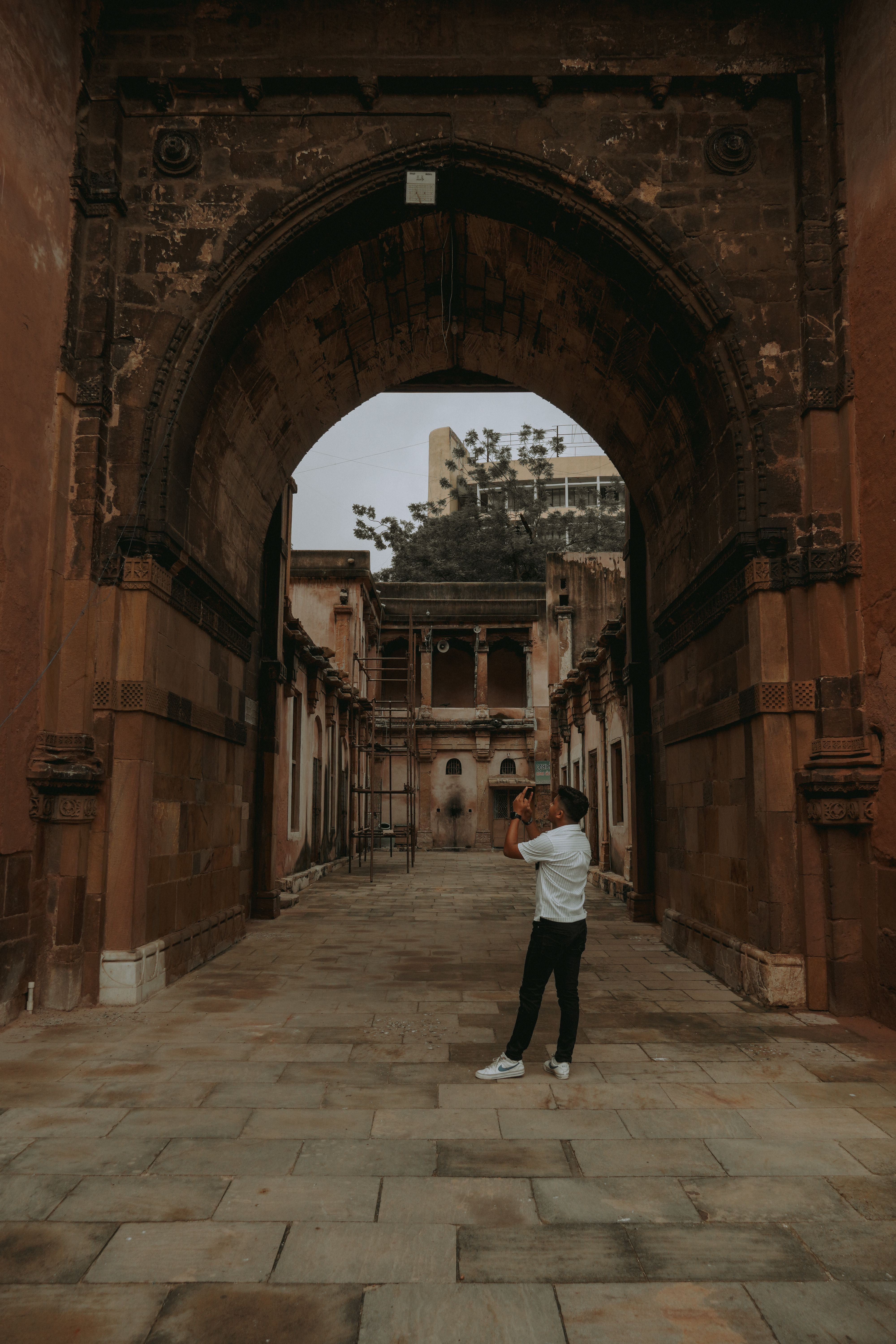 Man Taking Photo of Arch Street · Free Stock Photo